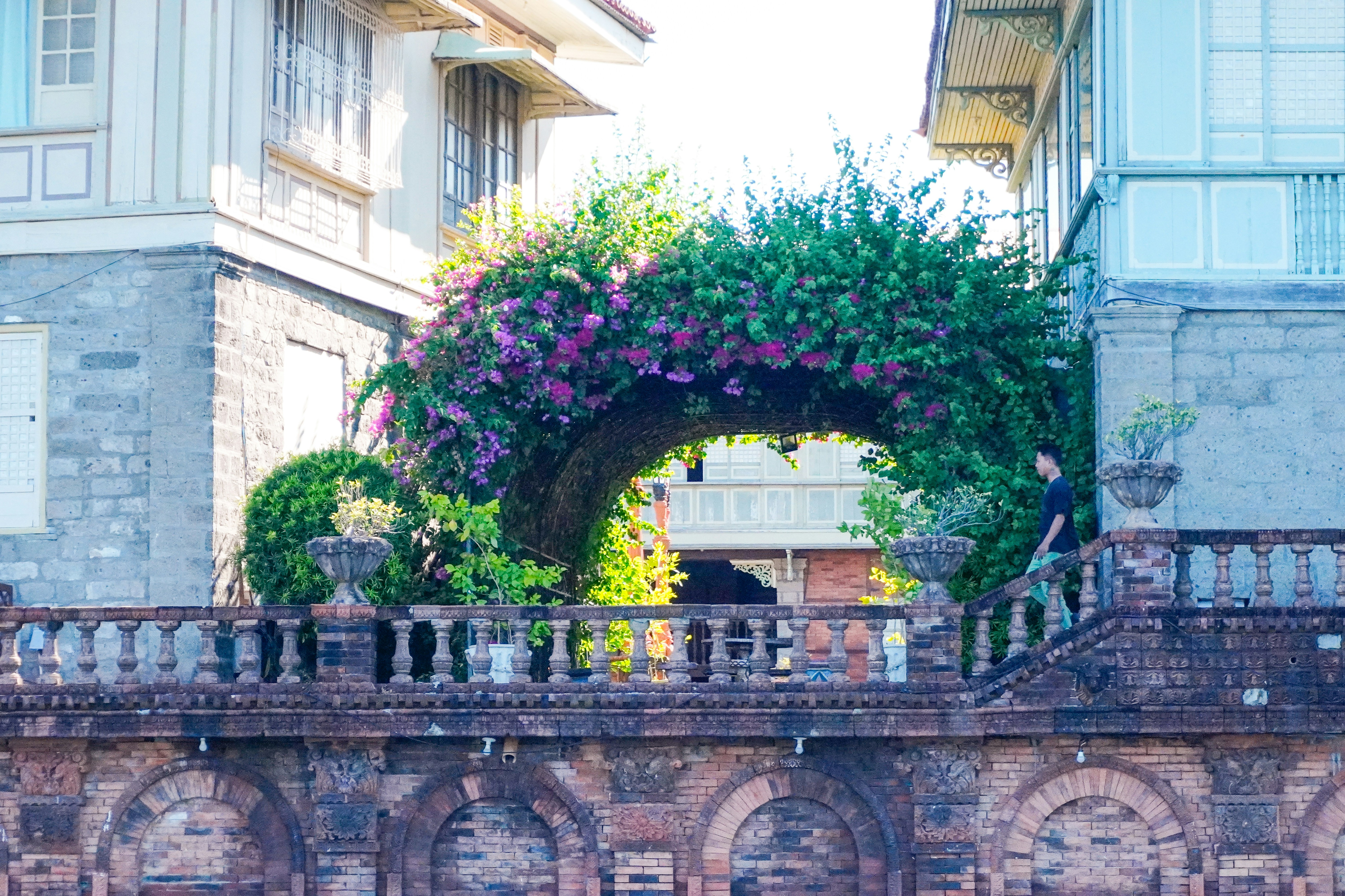 Floral Archway Over Vintage Brick Terrace