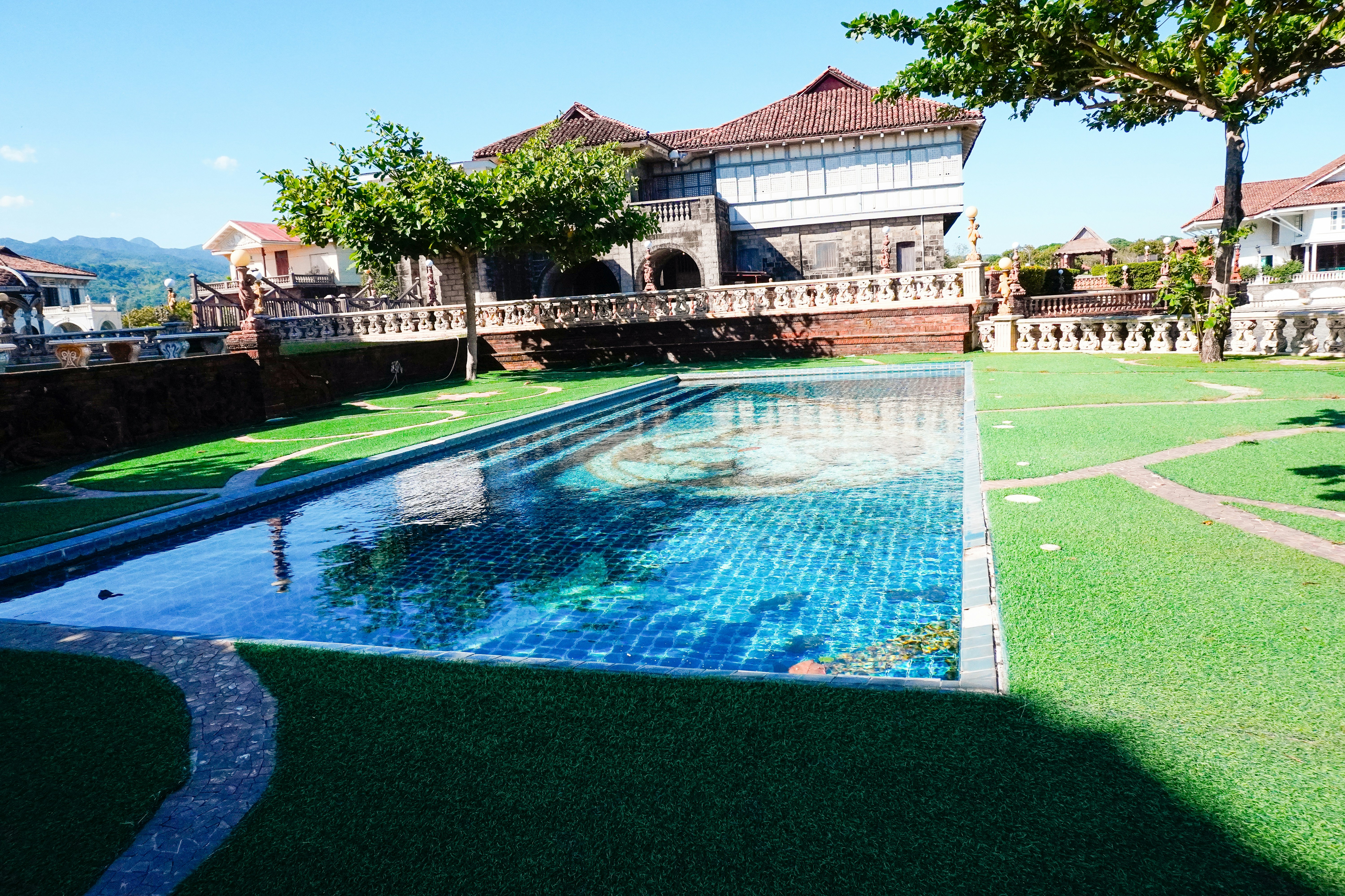Sunlit Terrace Overlooking a Silver-Blue Pool