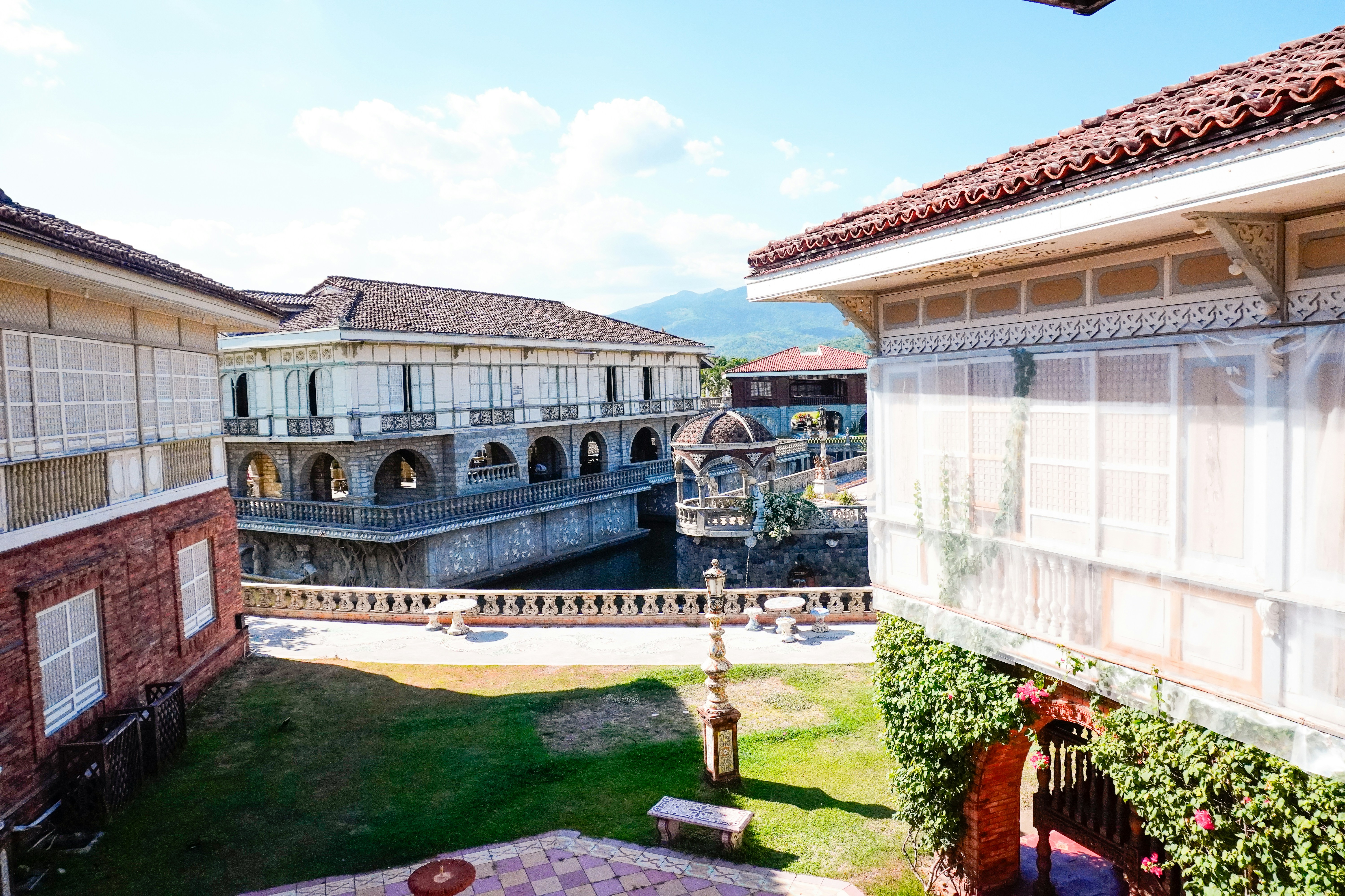Courtyard of Light: Sunlit Facades and Arched Silhouettes