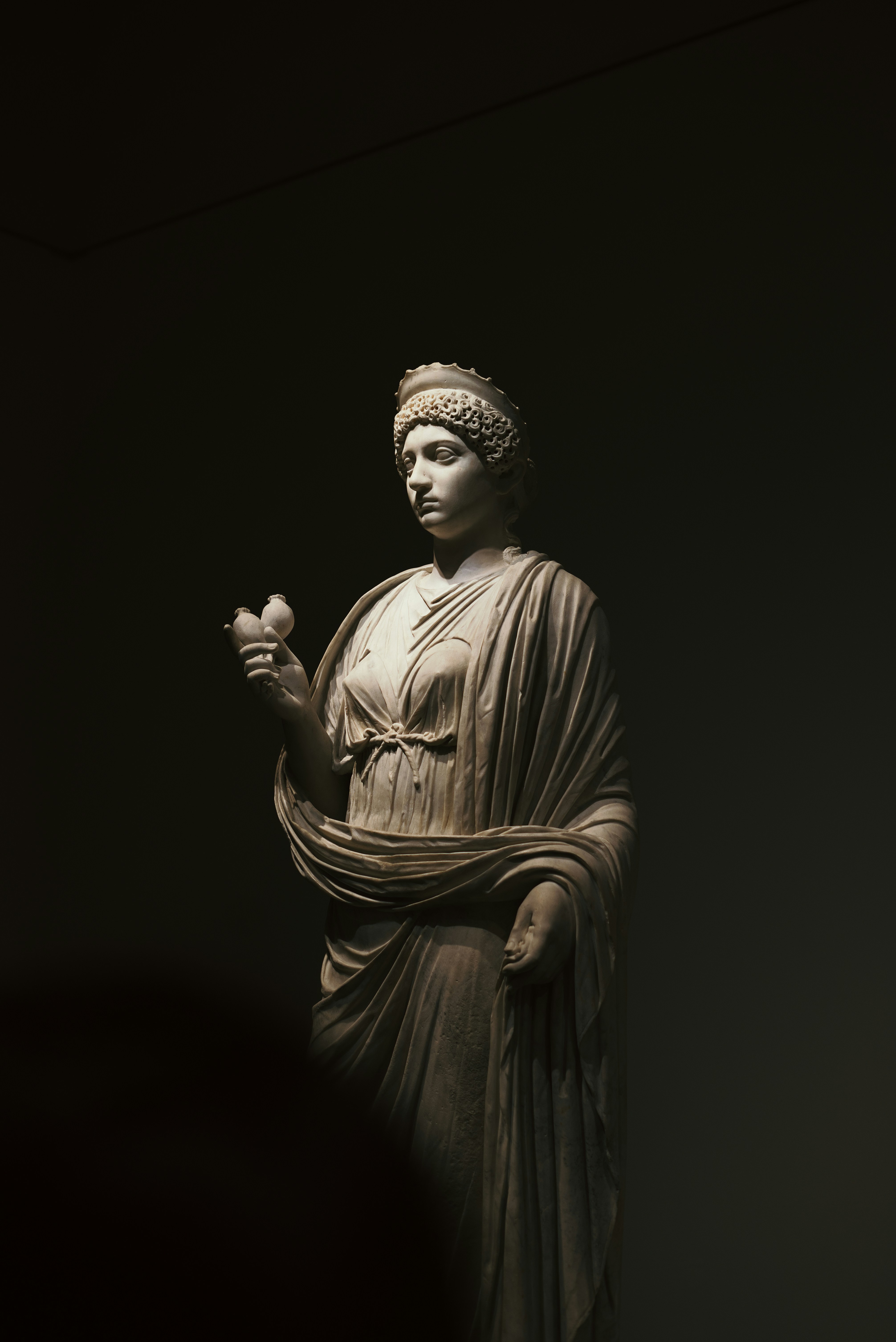Sculpted Quiet: A solitary statue bathed in gentle chiaroscuro