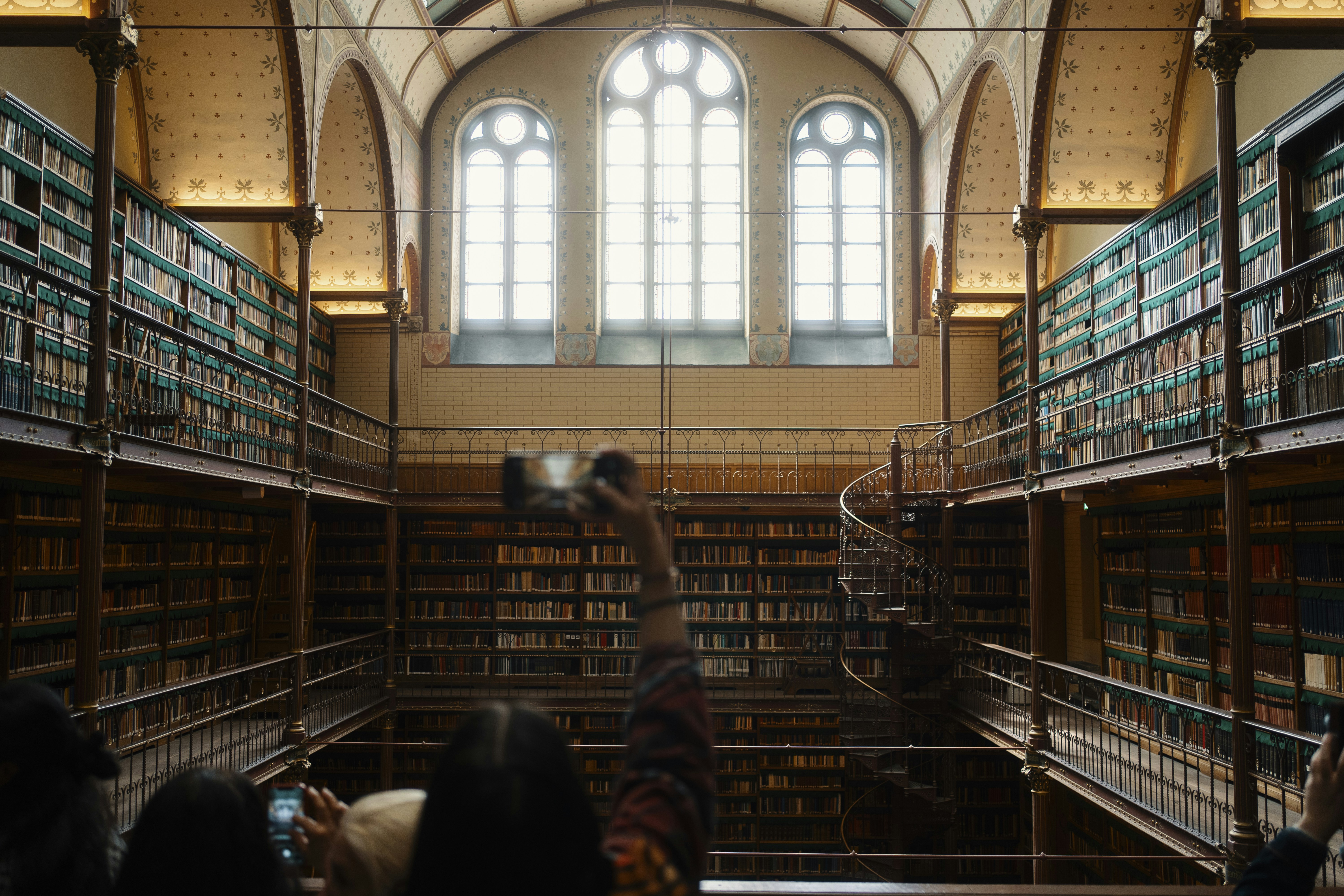 A Quiet Wave of Knowledge: Hands Raised in the Library Atrium