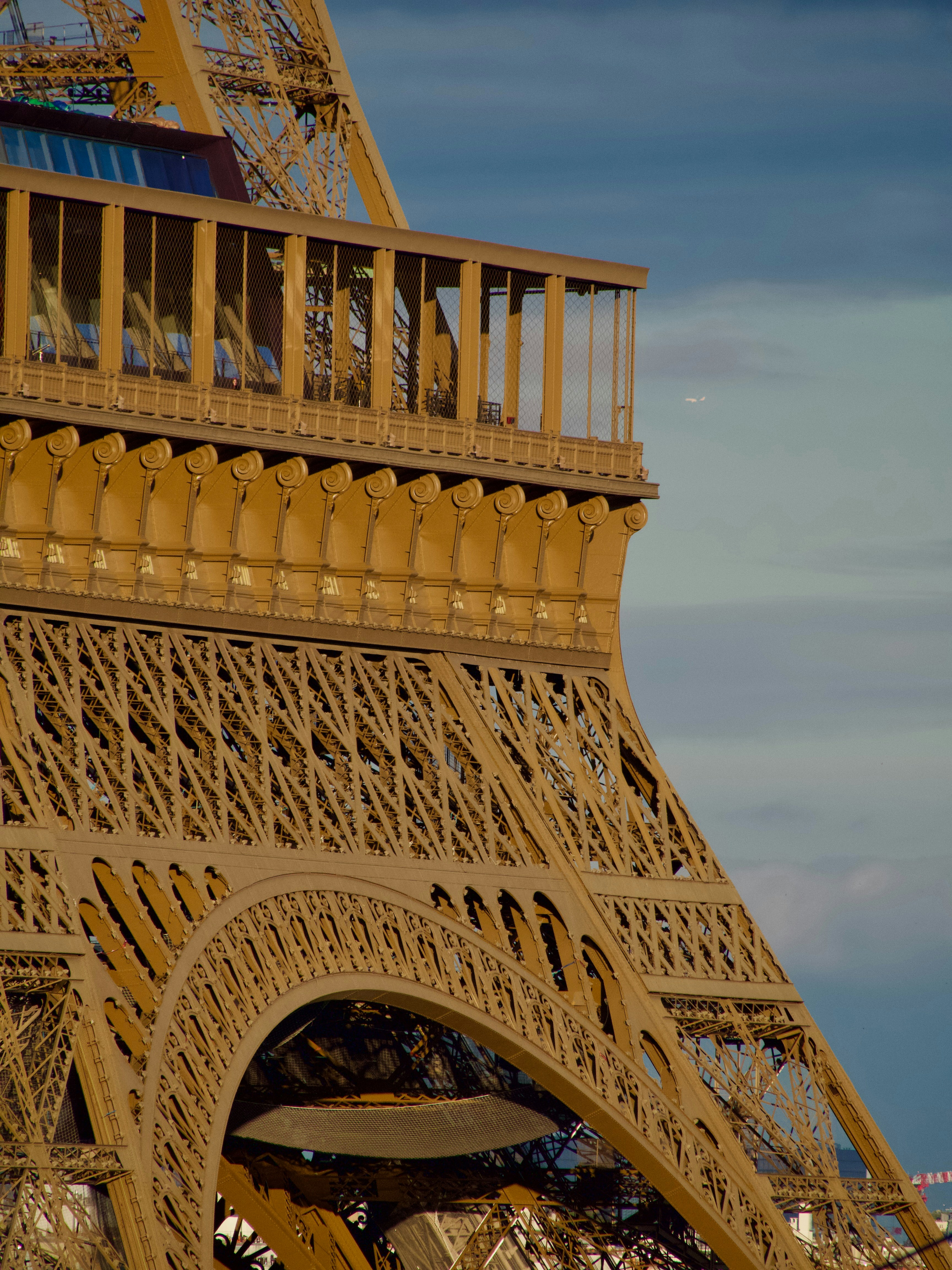 Golden Girders: The Eiffel Tower’s Lattice in Warm Evening Light