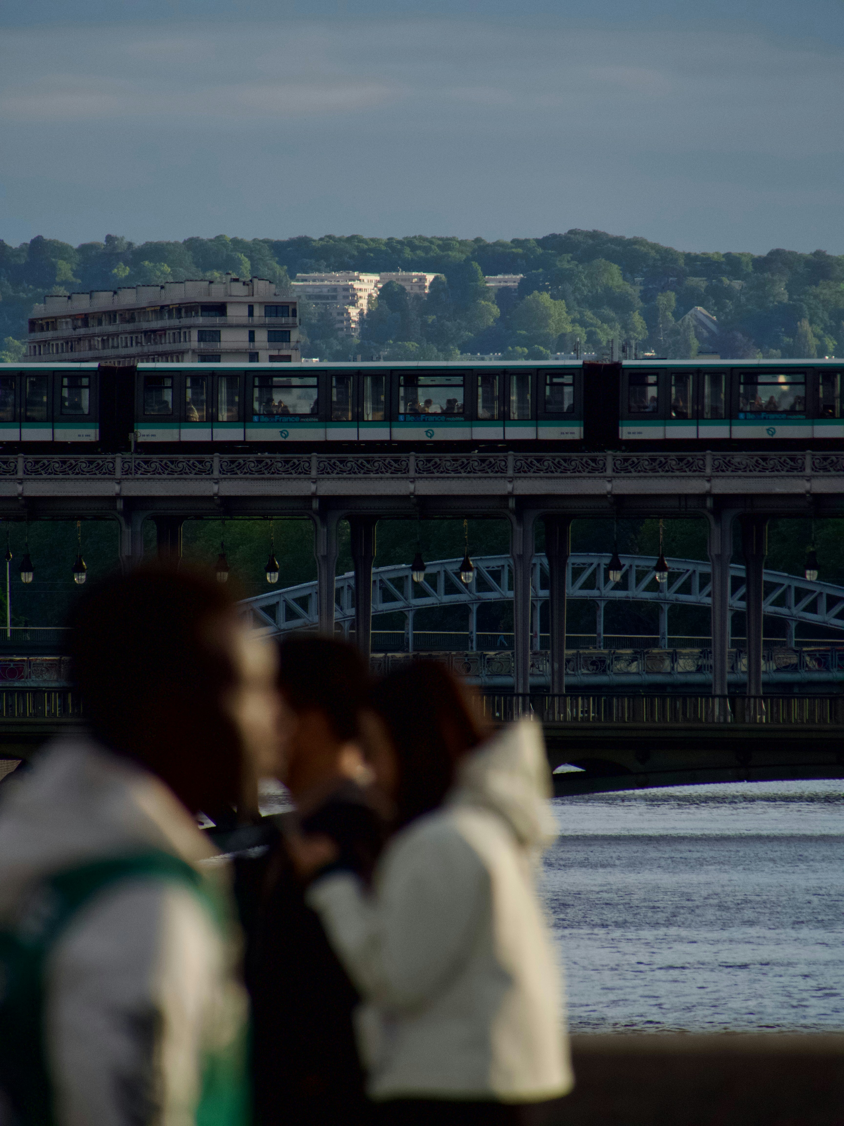 Midscene Transit over the Thames: Train, Bridge, and Fading Crowd
