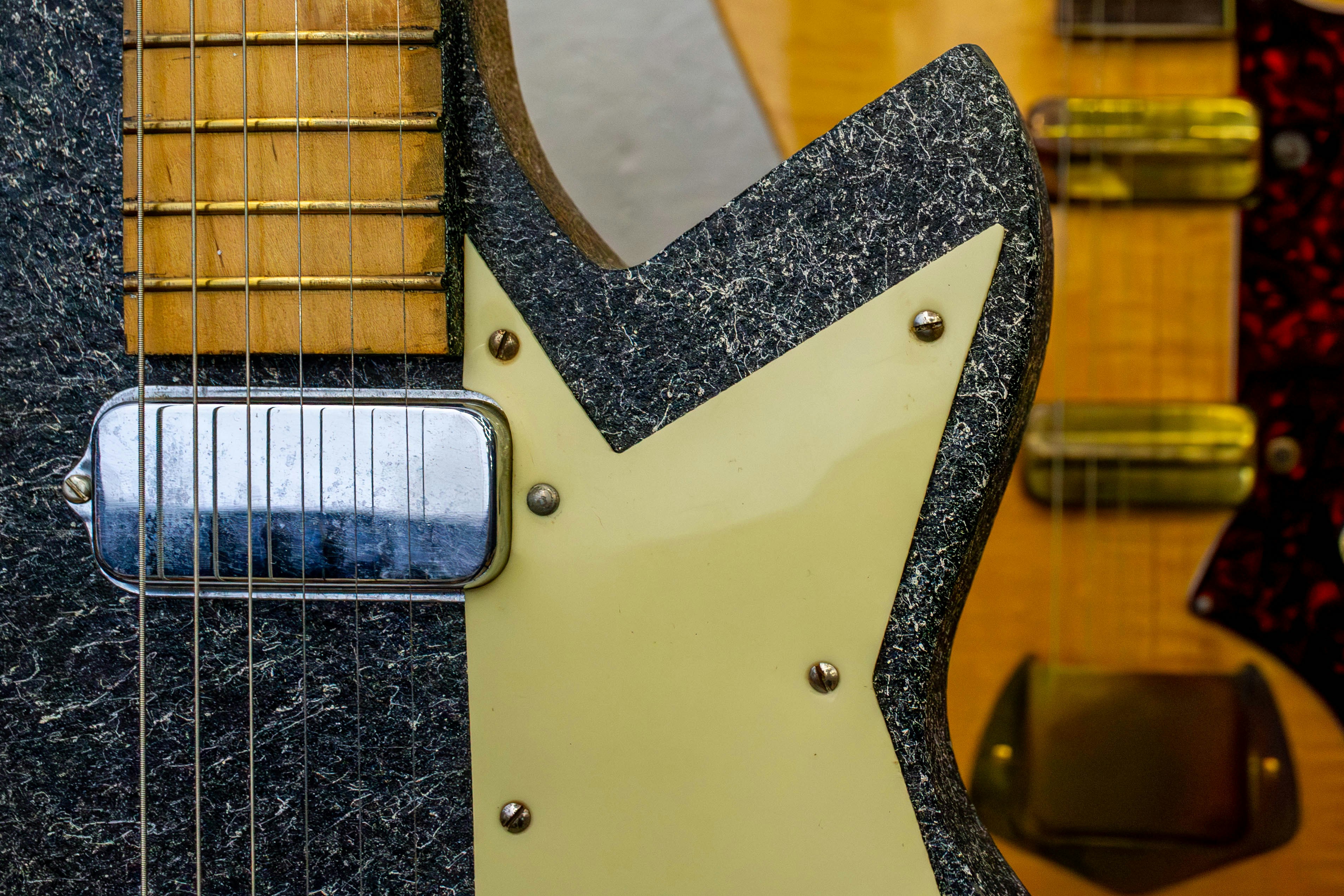 Dual-tone Fender Edge: A Weathered Guitar with Shimmering Hardware