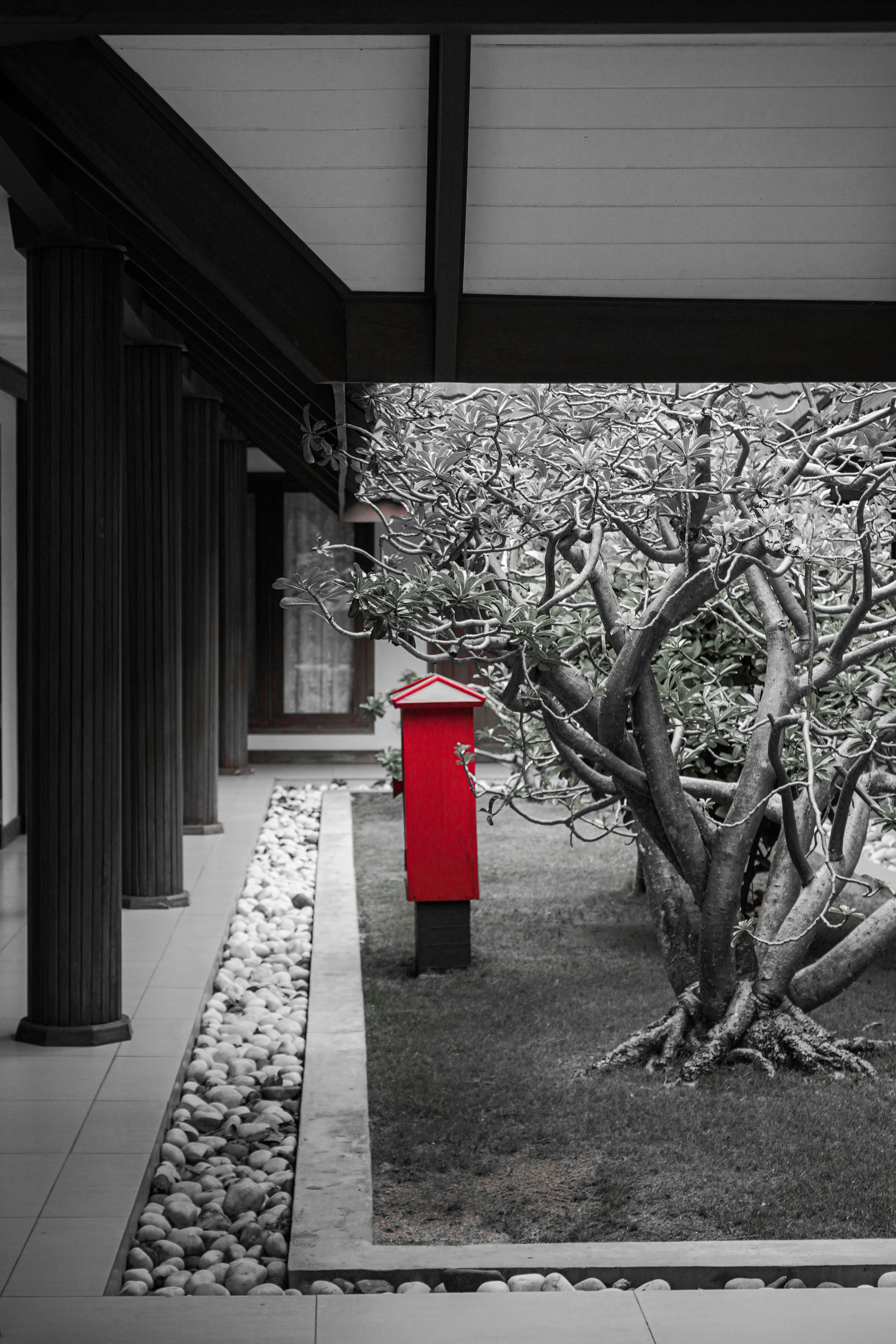 Red Mailbox in a Tranquil Japanese Courtyard