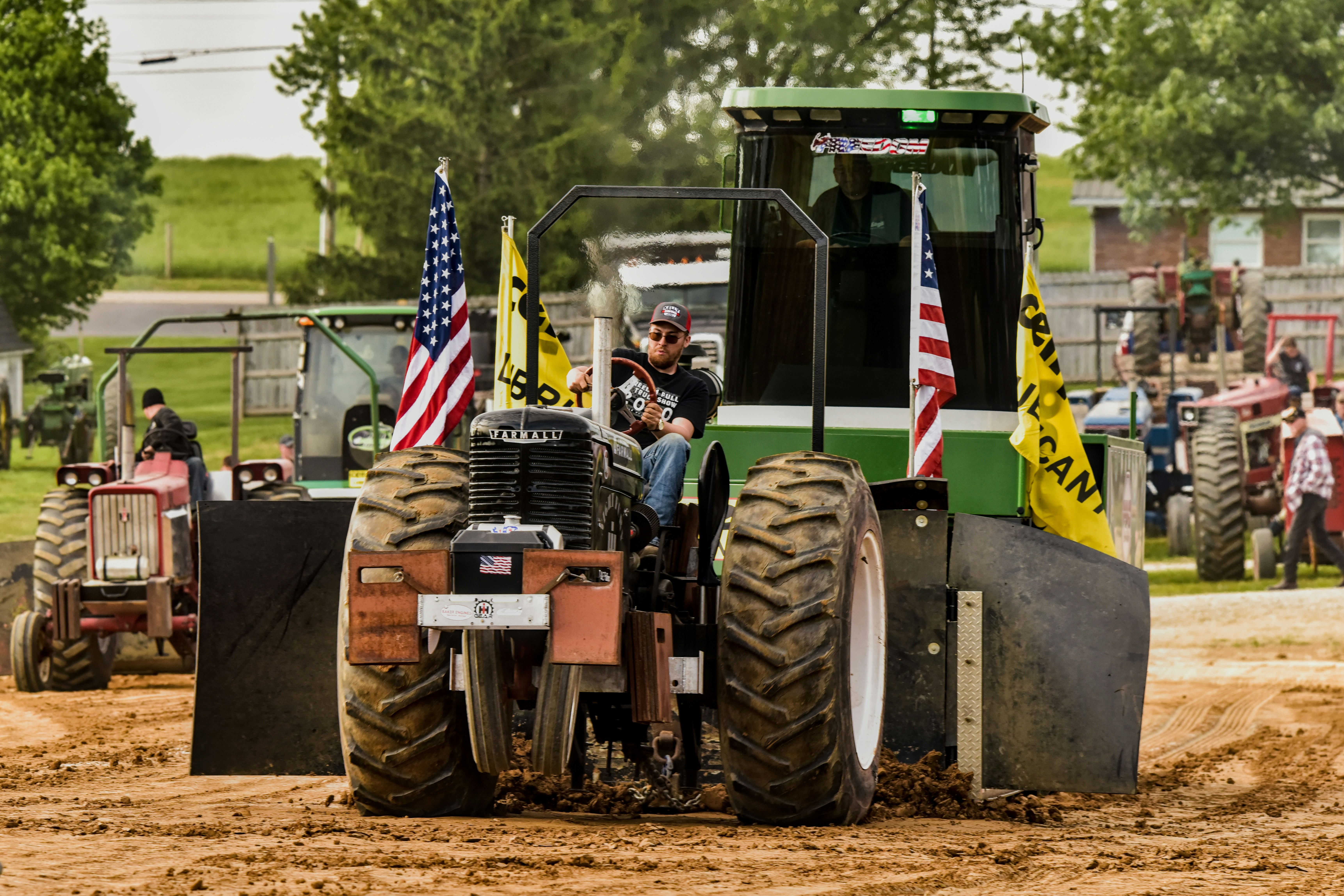 Powerful Parade: A Green Tractor Leads the Grounded Show