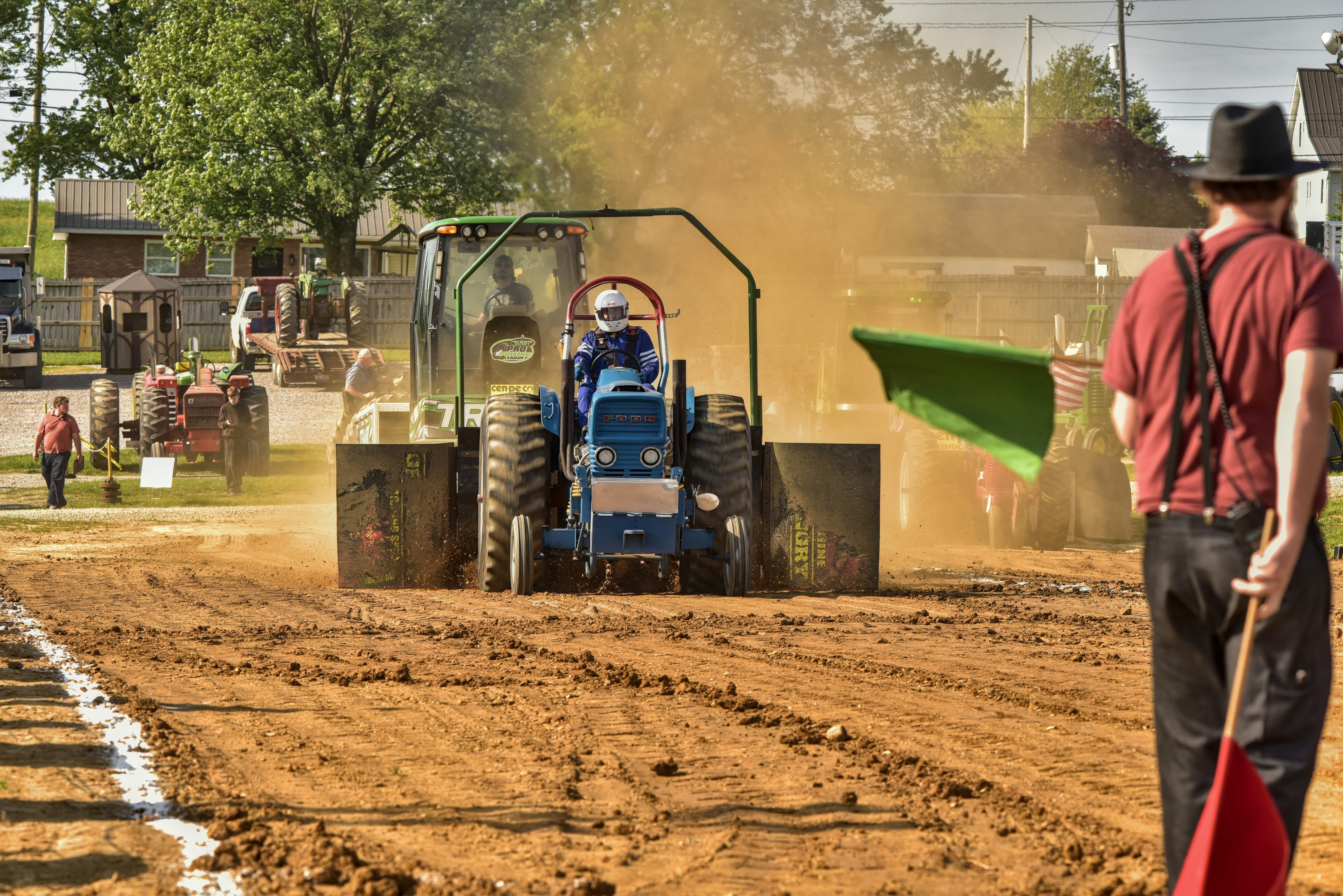 Dust, Dust, and a Blue Tractor: A Tractor Pull in Motion