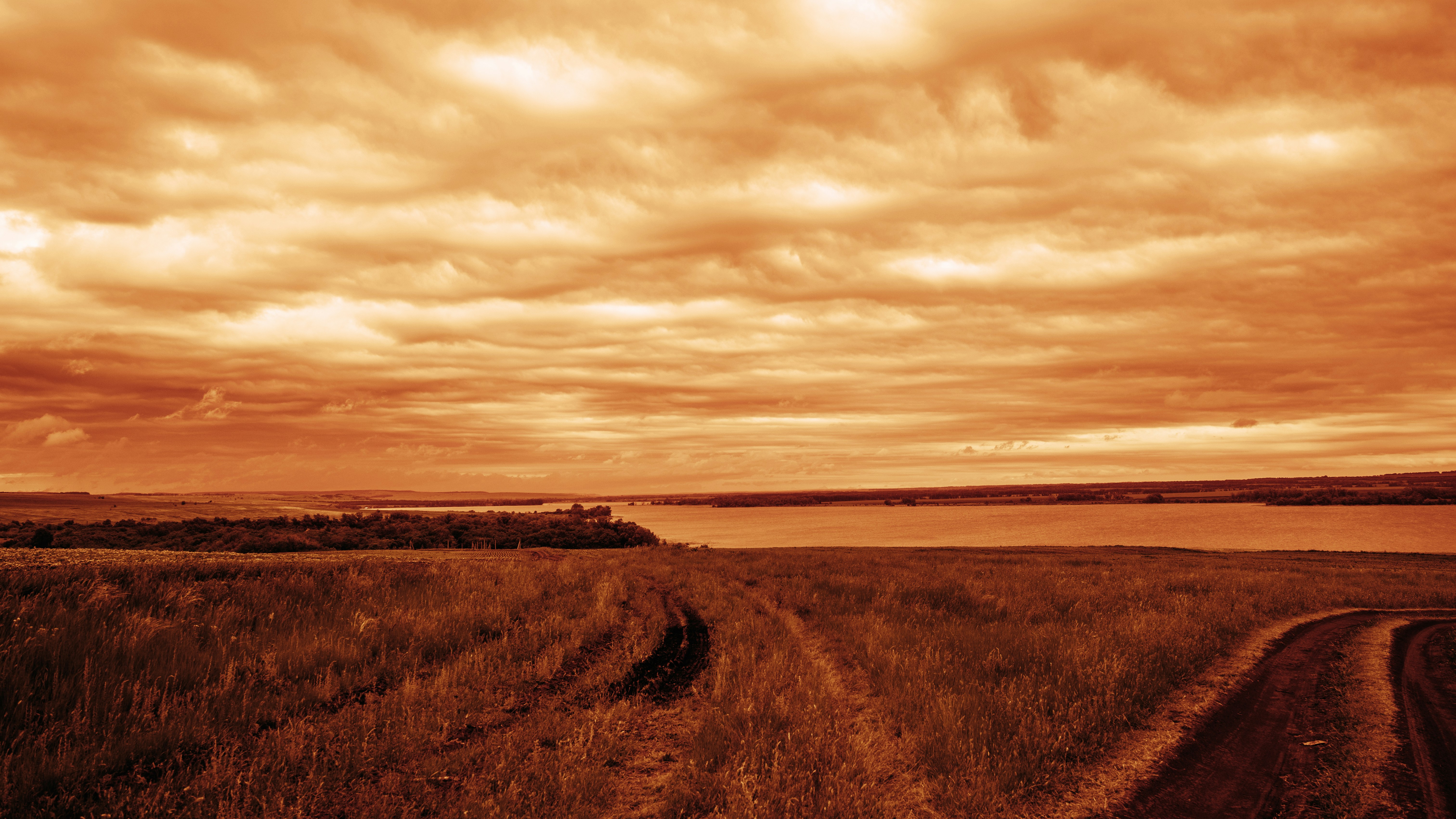 Dusty Road to Dusk Over Prairie Flats