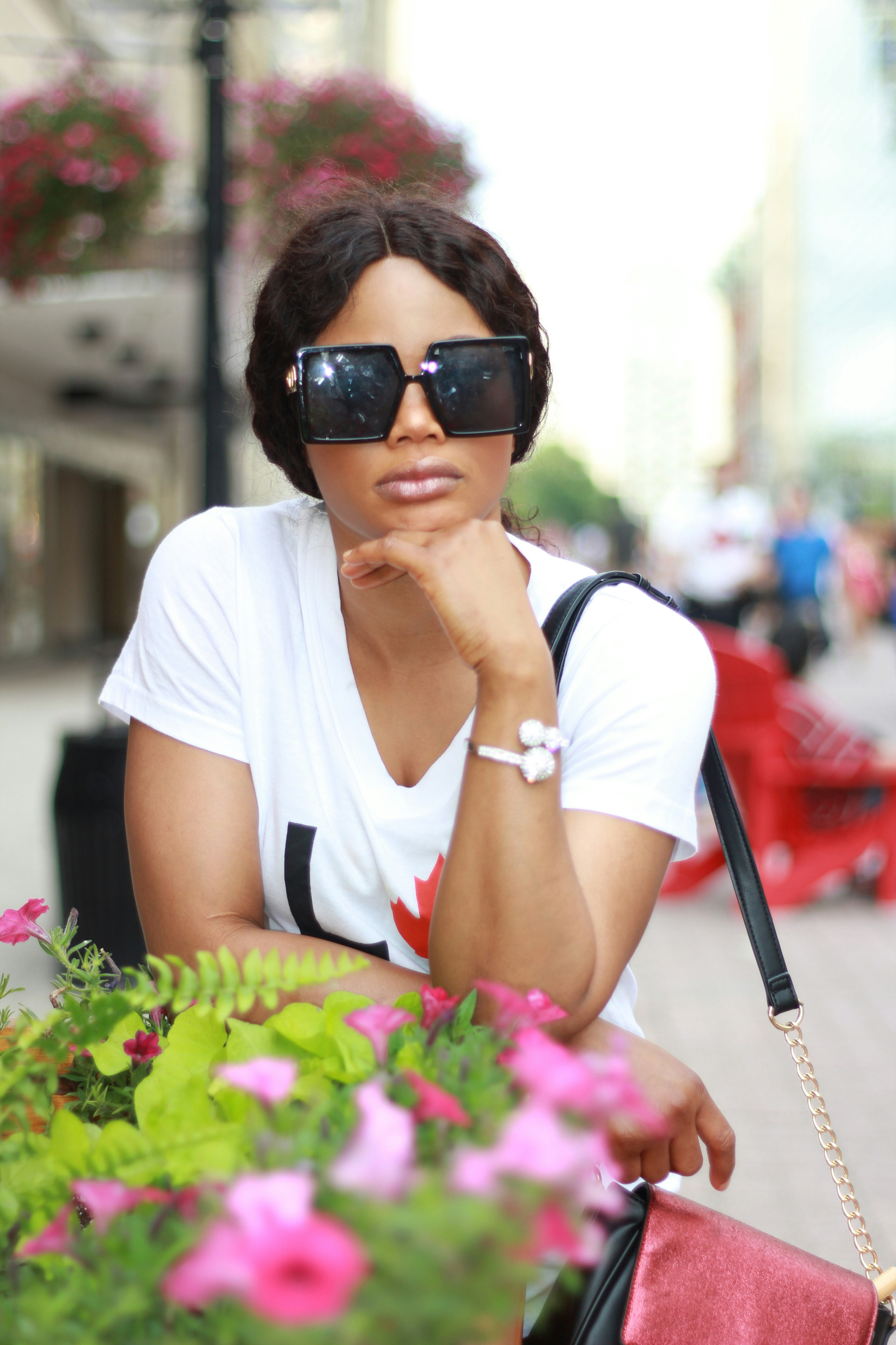 City Chic: A Bold Portrait in Sunglasses and Street Florals