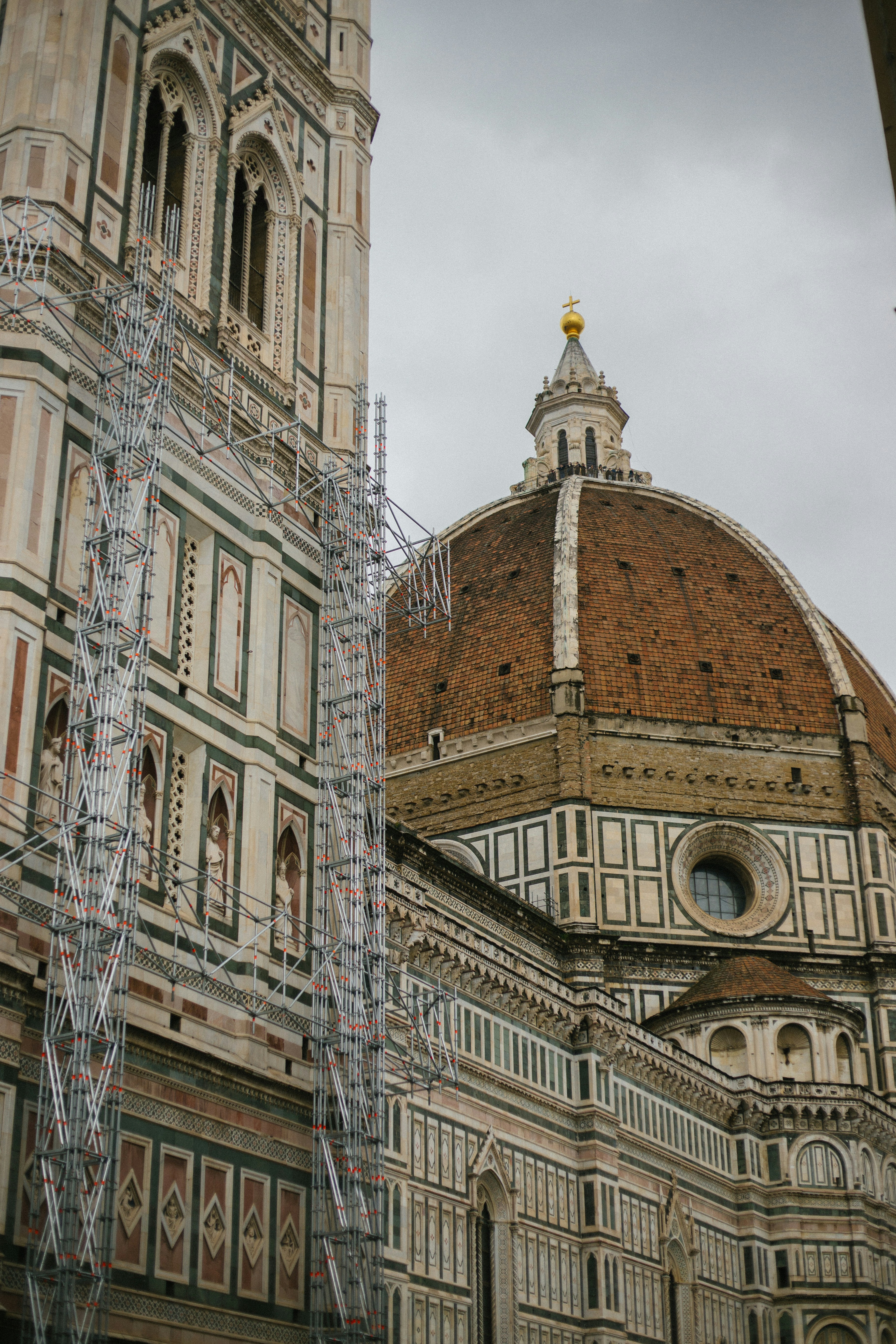 Ornate Facade and Dome of a Florentine Cathedral under Scaffolding