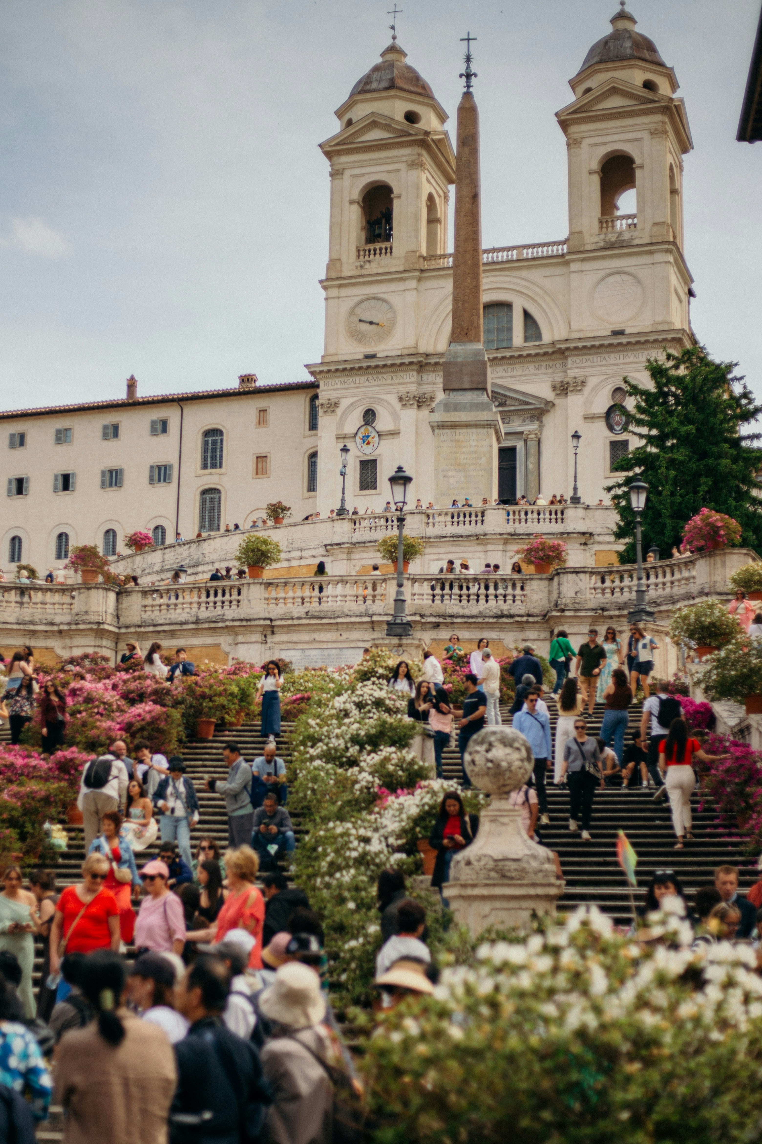 Steps to the Sacred Terrace: Crowds Gather Before the Baroque Basilica