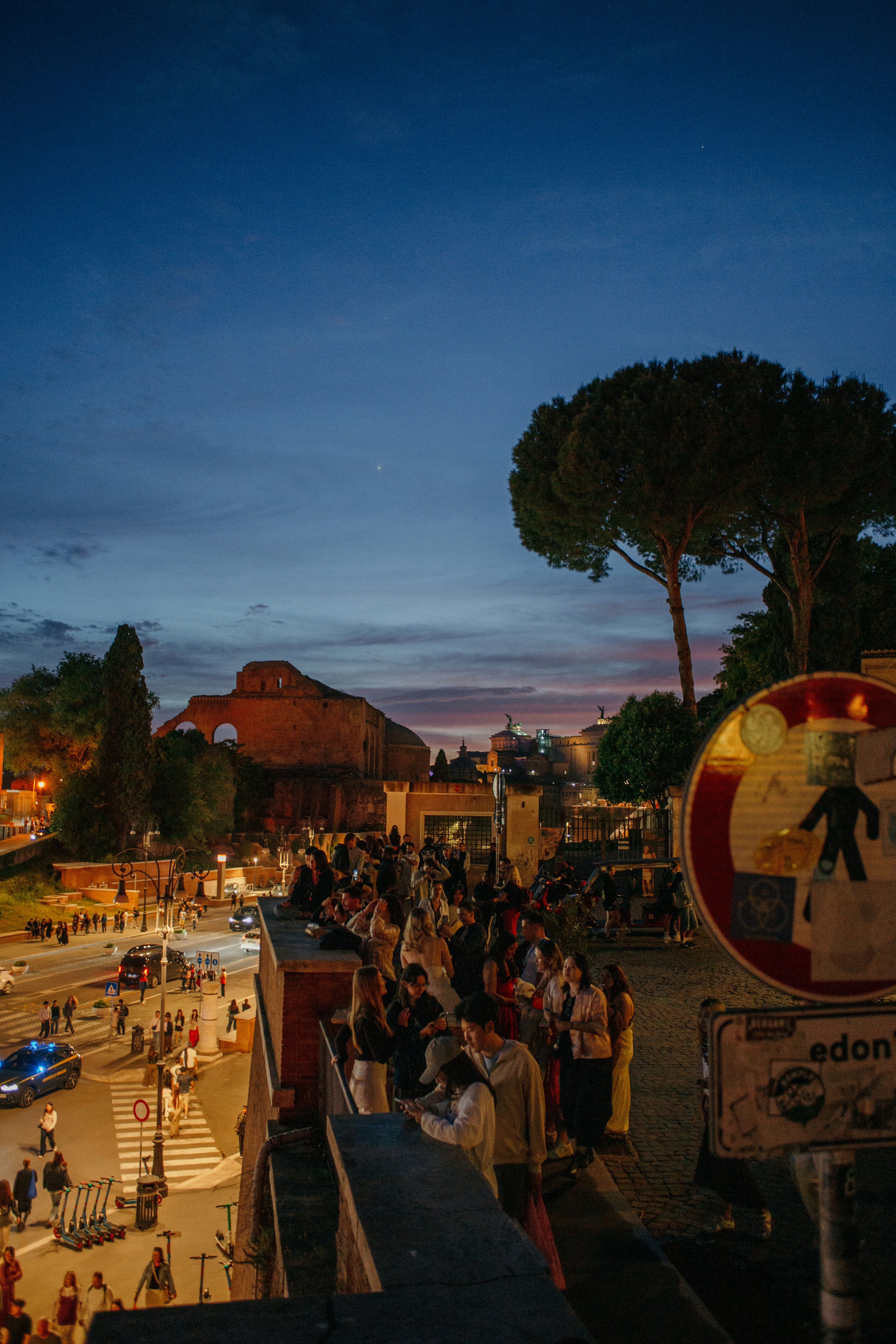 Evening at the Ramparts: A Crowd Casts a Shadow Over Ancient Walls