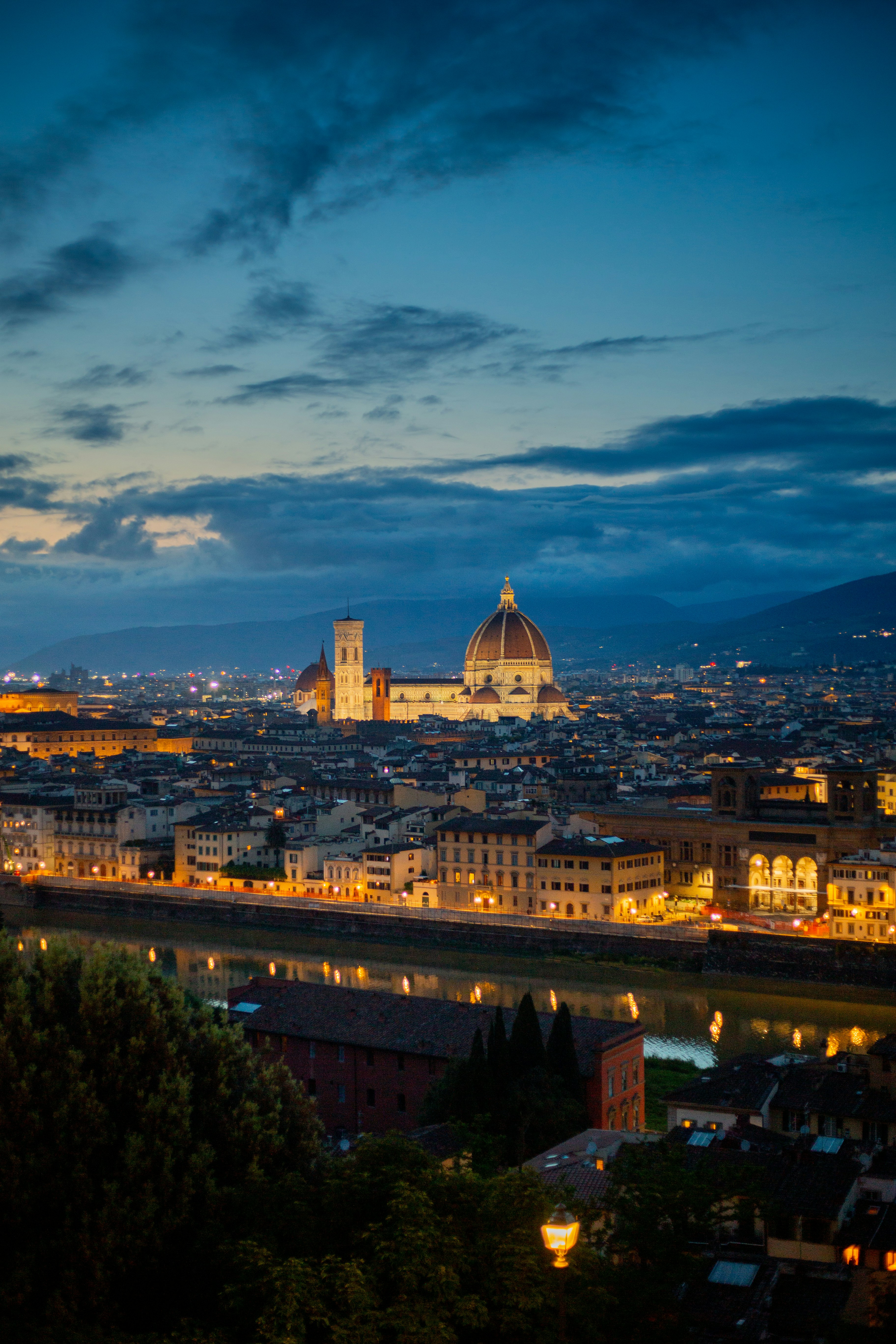 Florentine Dusk: The Cathedral and River Glow Over Florence