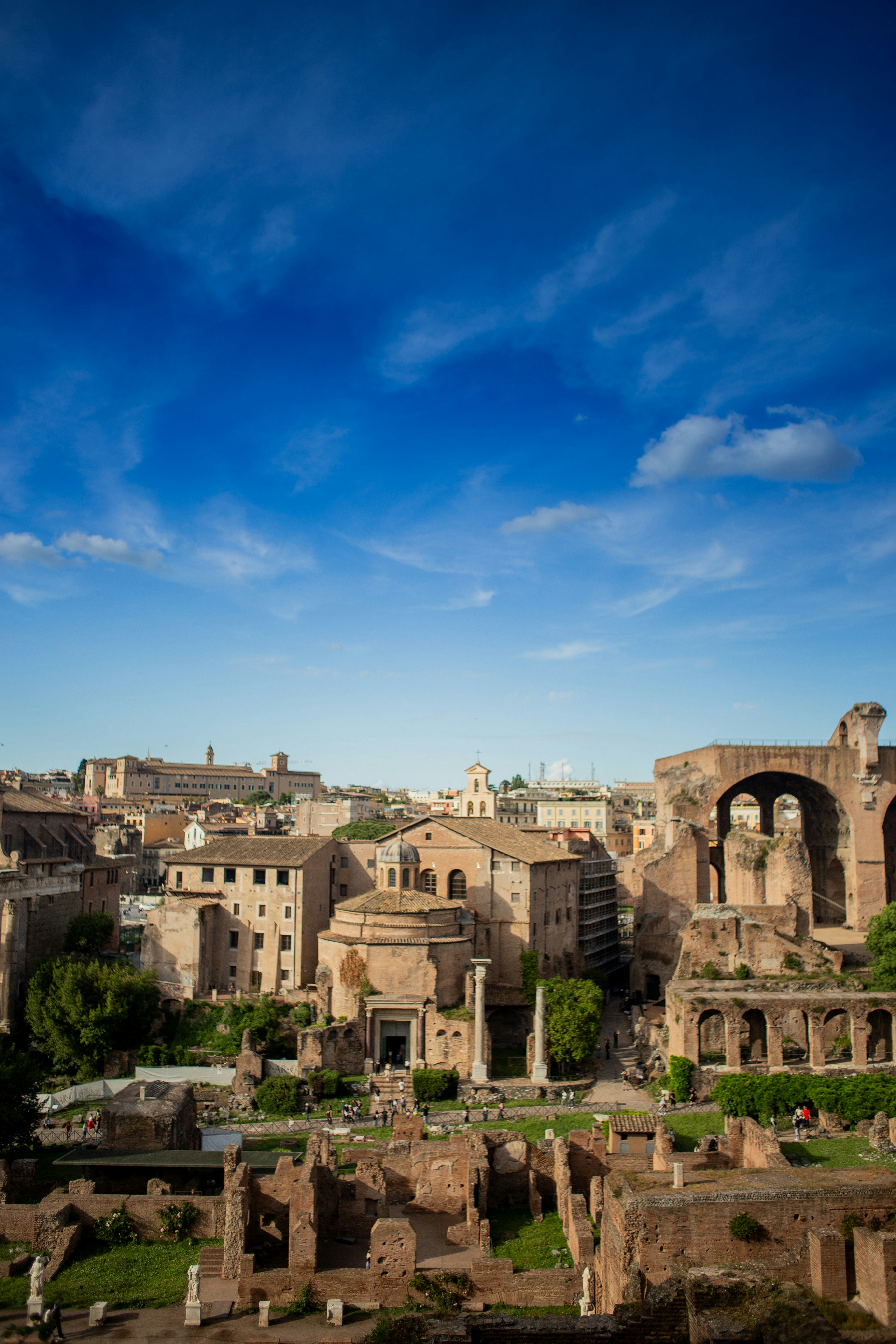 Ruined Forum Mosaic: Ancient Stones Beneath a Clear Italian Sky