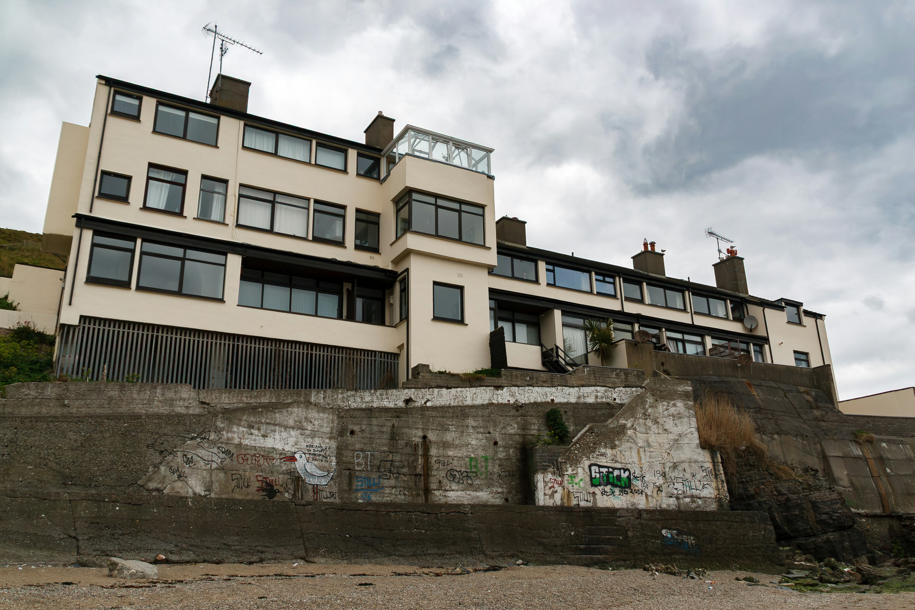 Terraced Modernist House Overlooking a Pebbled Beach