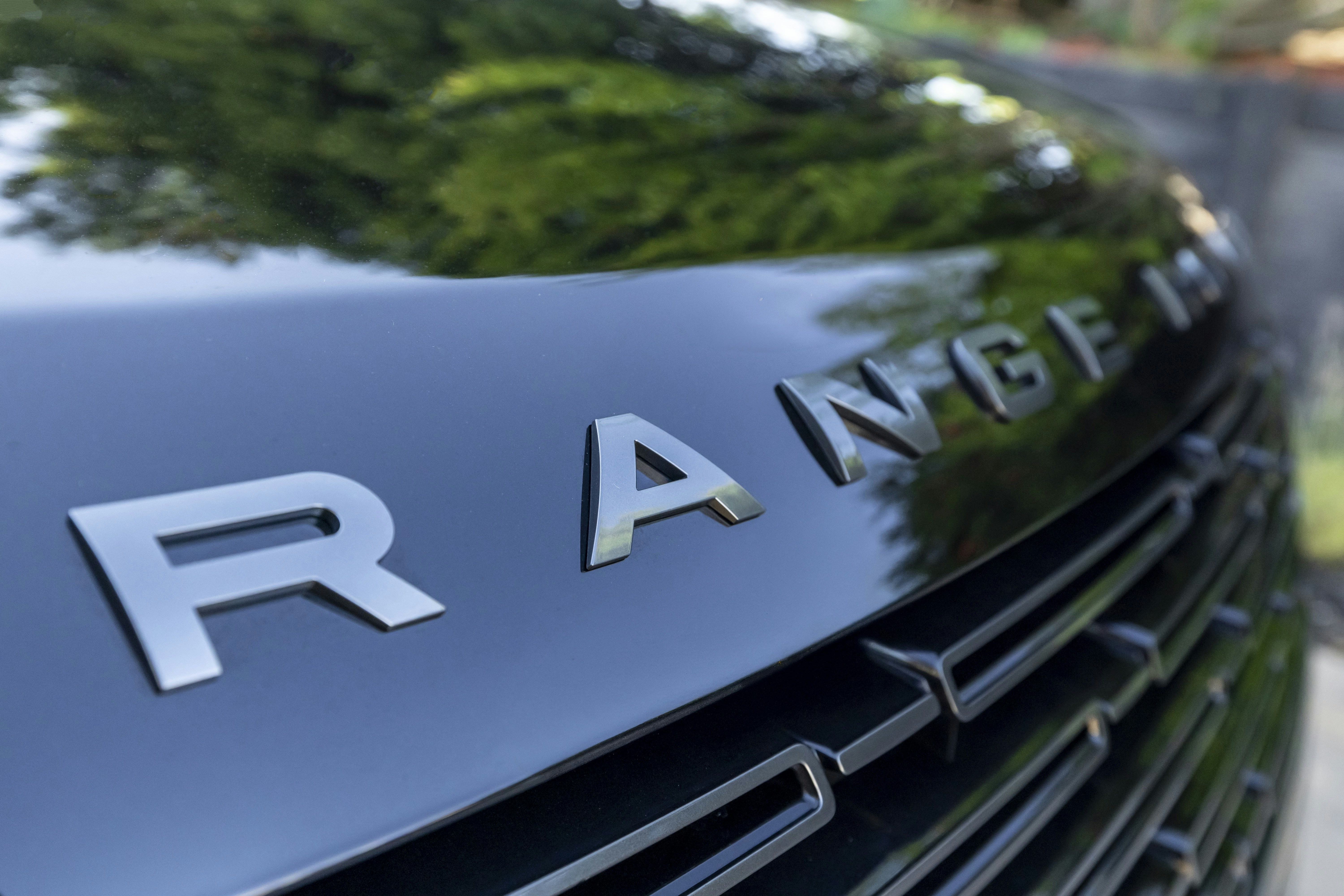 Chrome Crest: Close-Up of the Range Rover Grille Spelling out R A N G E R