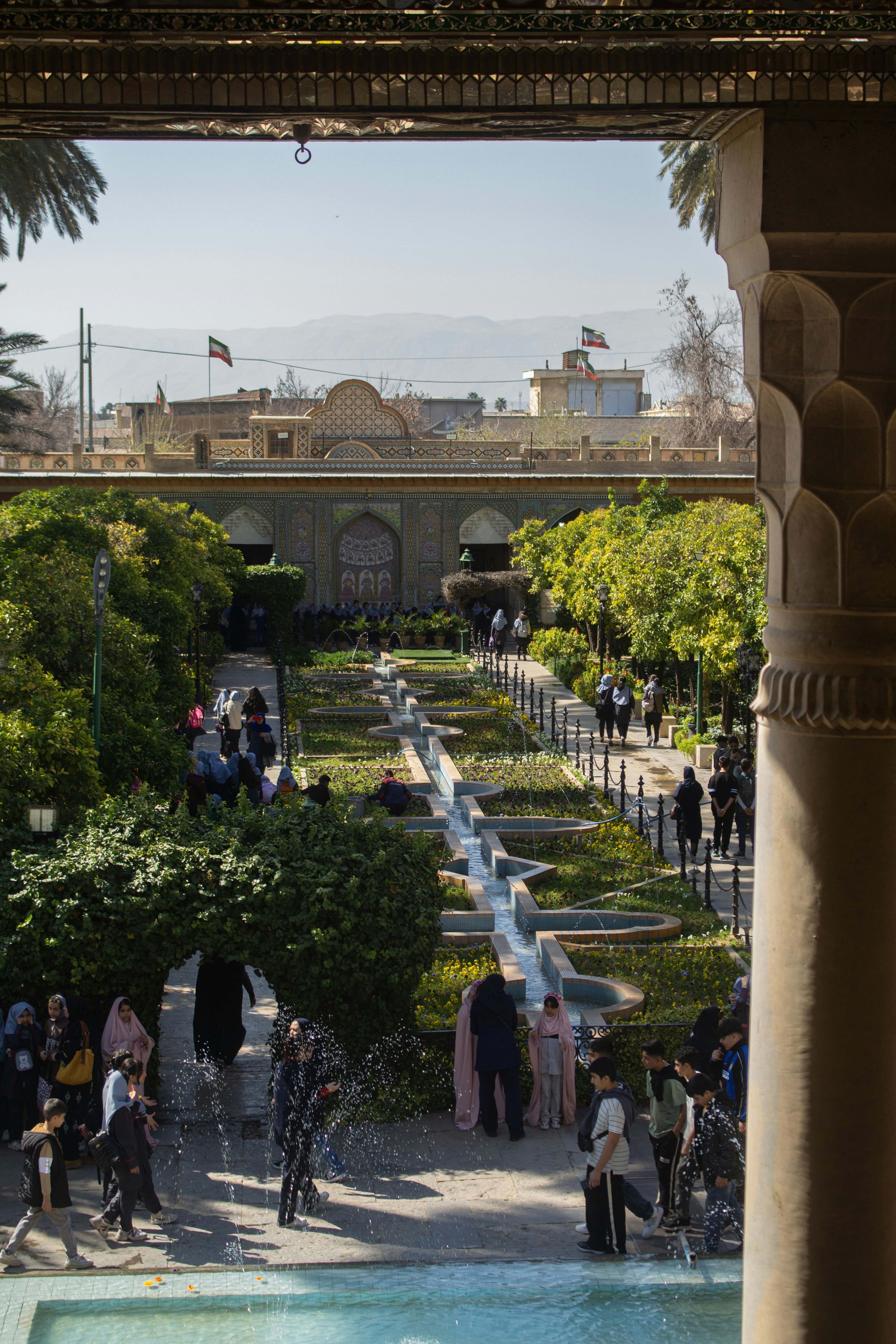 Courtyard of Echoes: A Palm-fringed Haven Between Arches