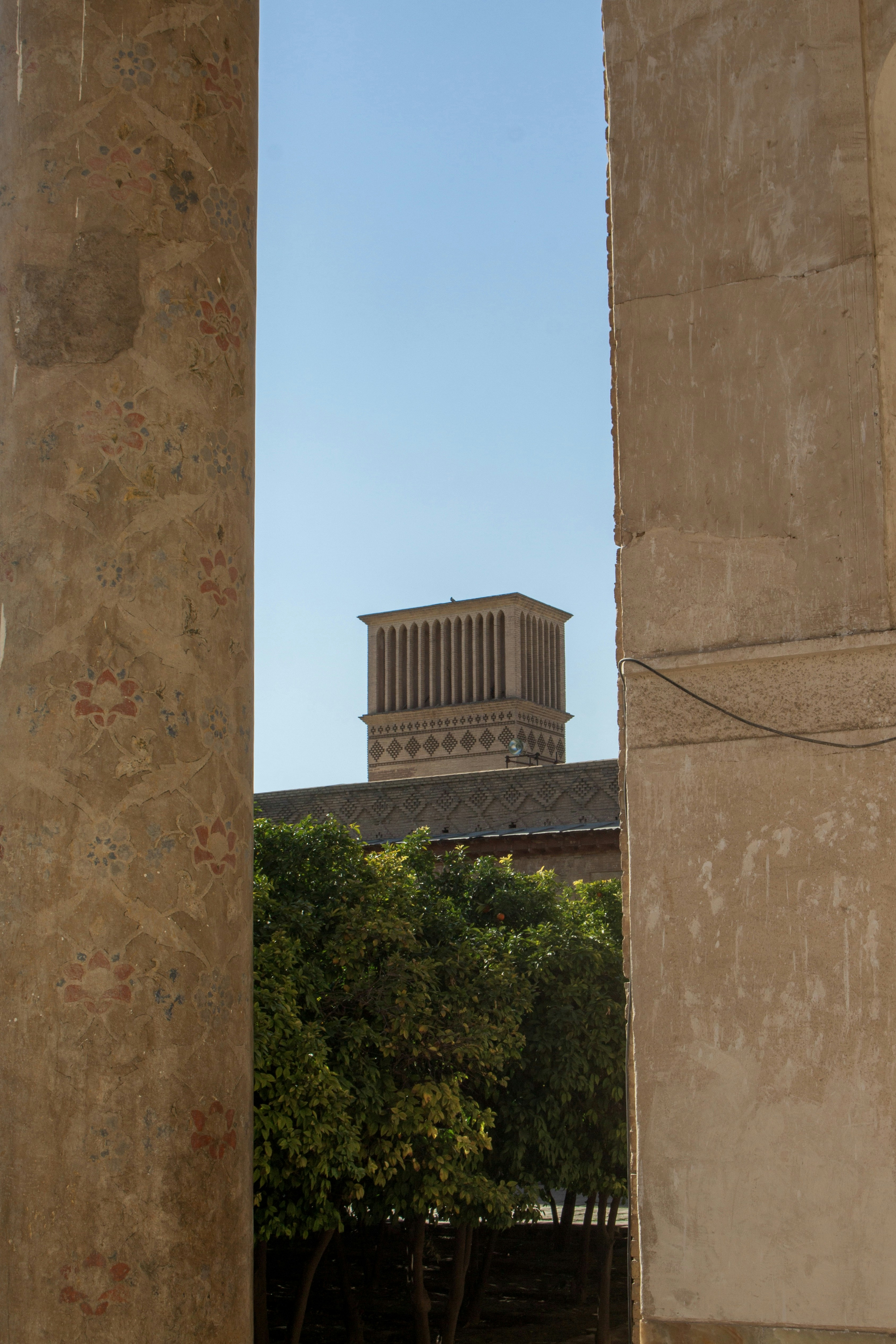 Through the Gate: Hidden Tower Framing Between Columns