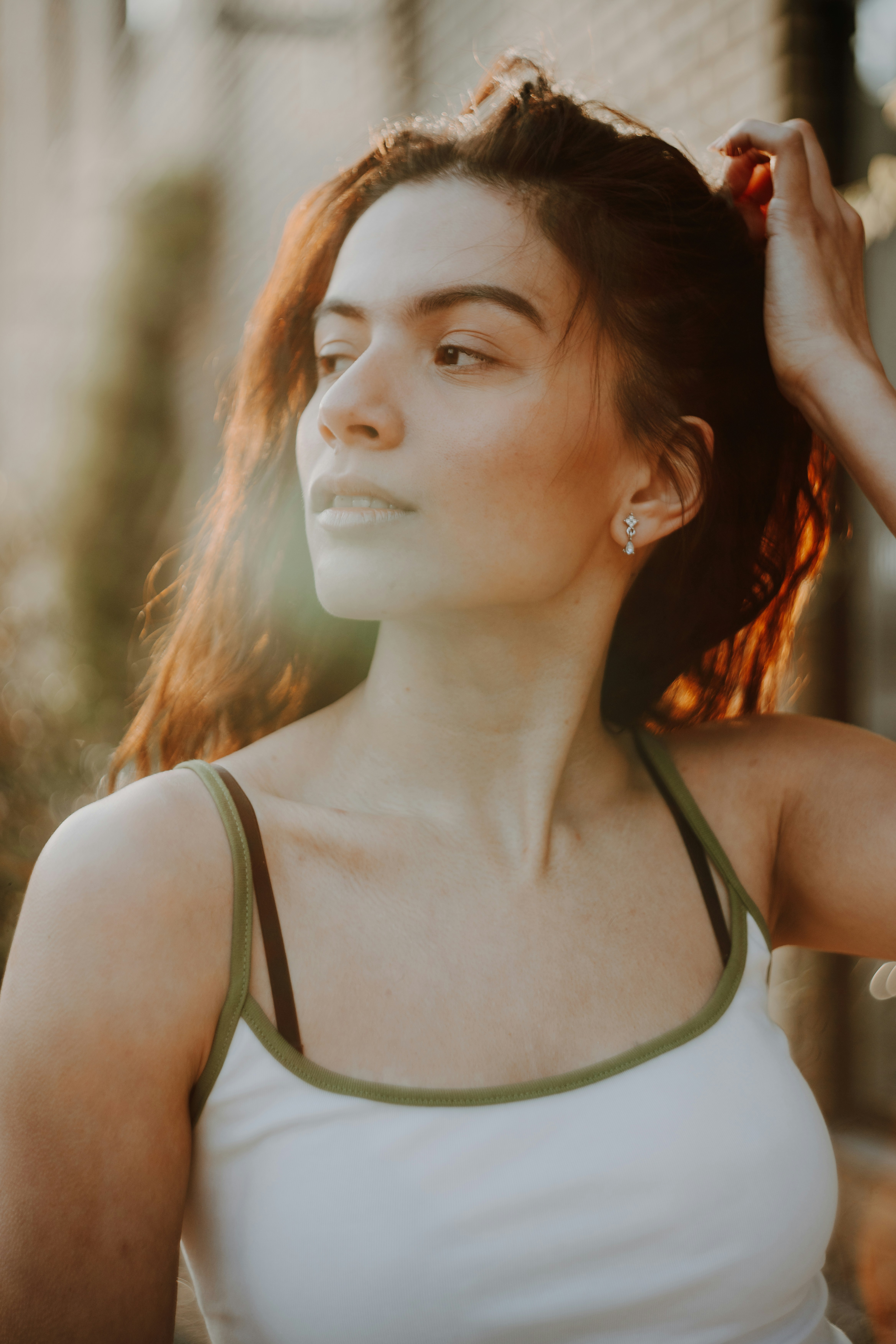 Soft, Golden Hour Portrait of a Woman with Wind-Caught Hair