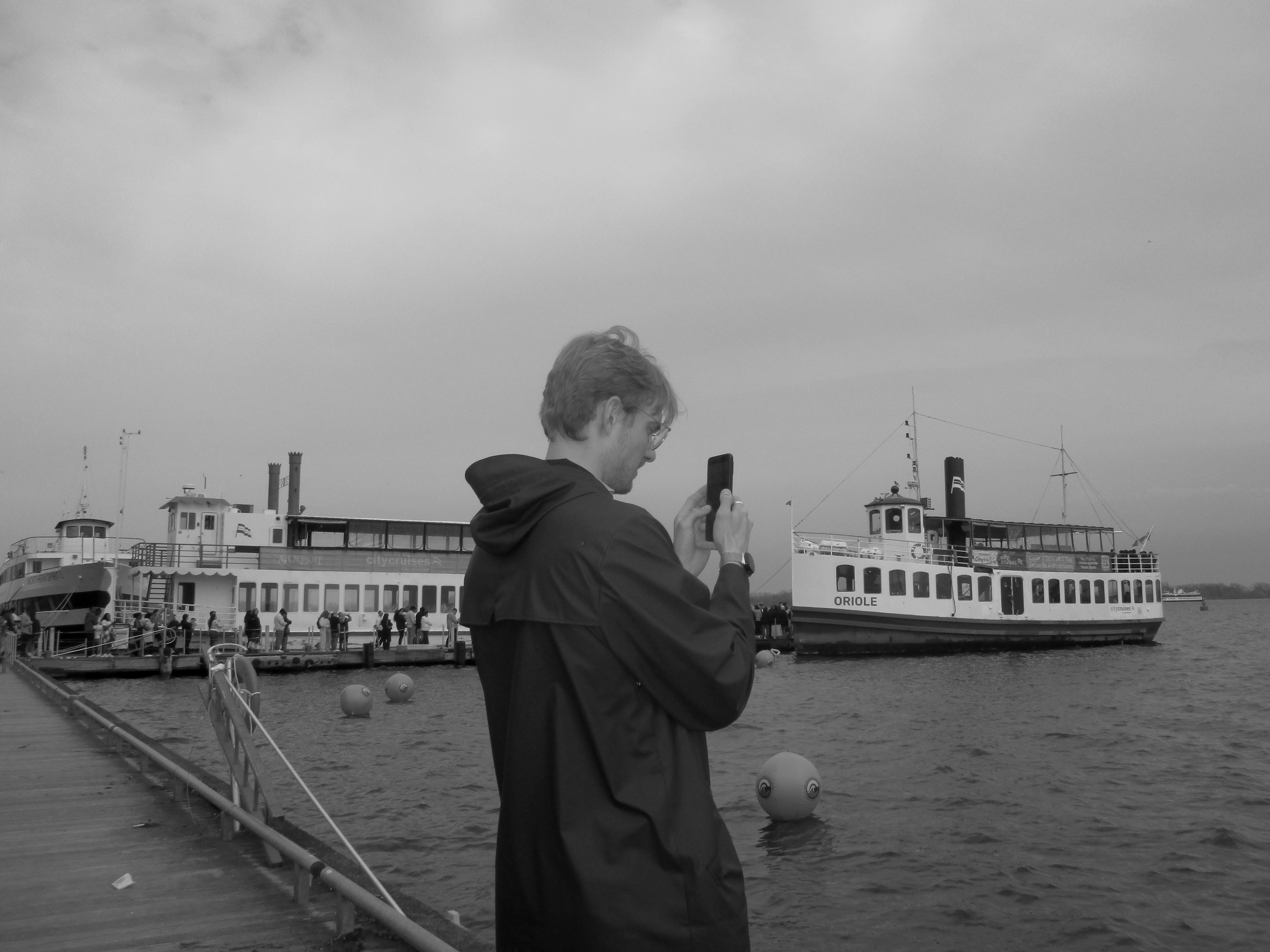 A quiet moment ashore: photographer at the pier