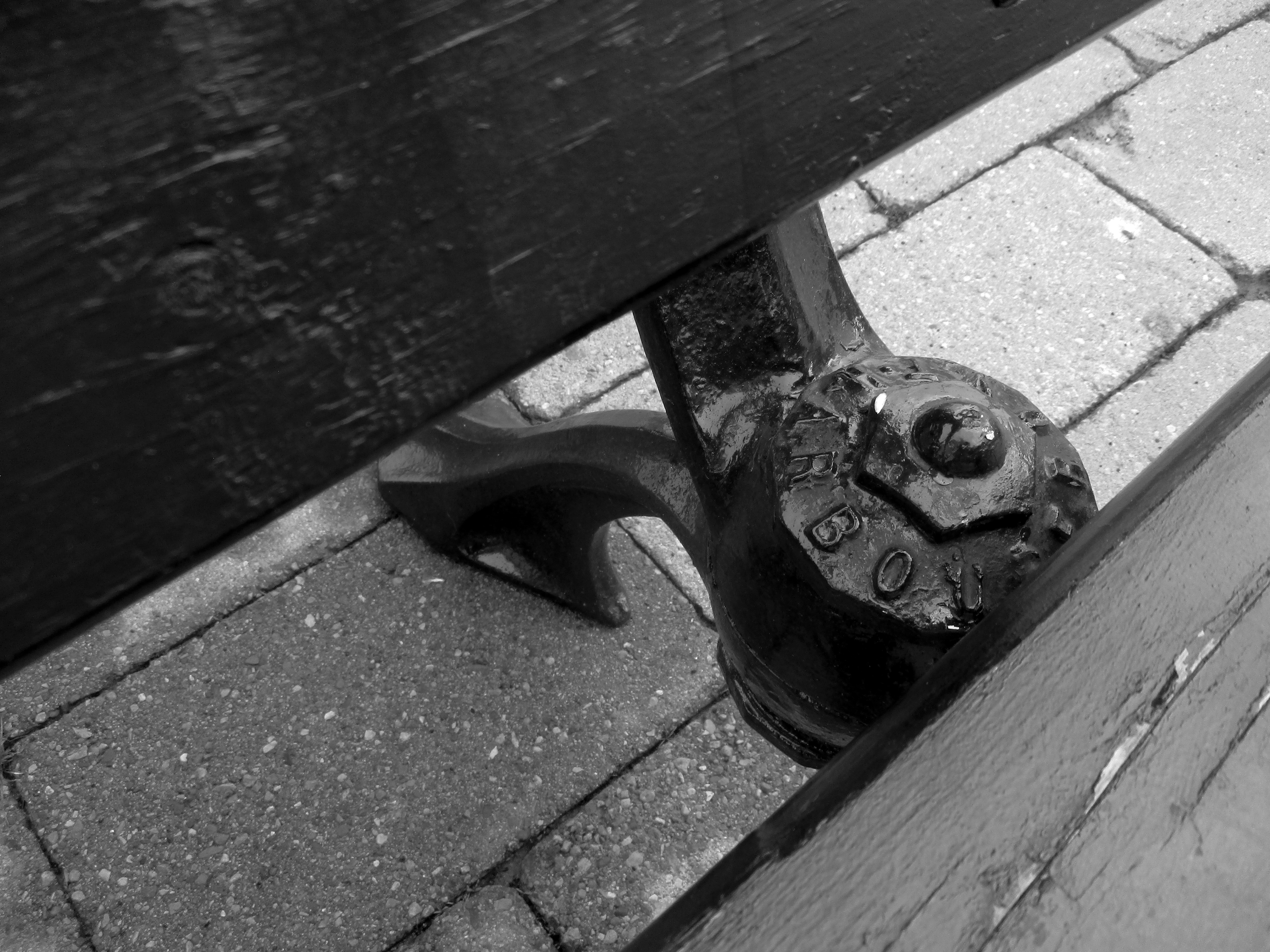 Lock and Latch: Close-up of a Weathered Gate Pivot