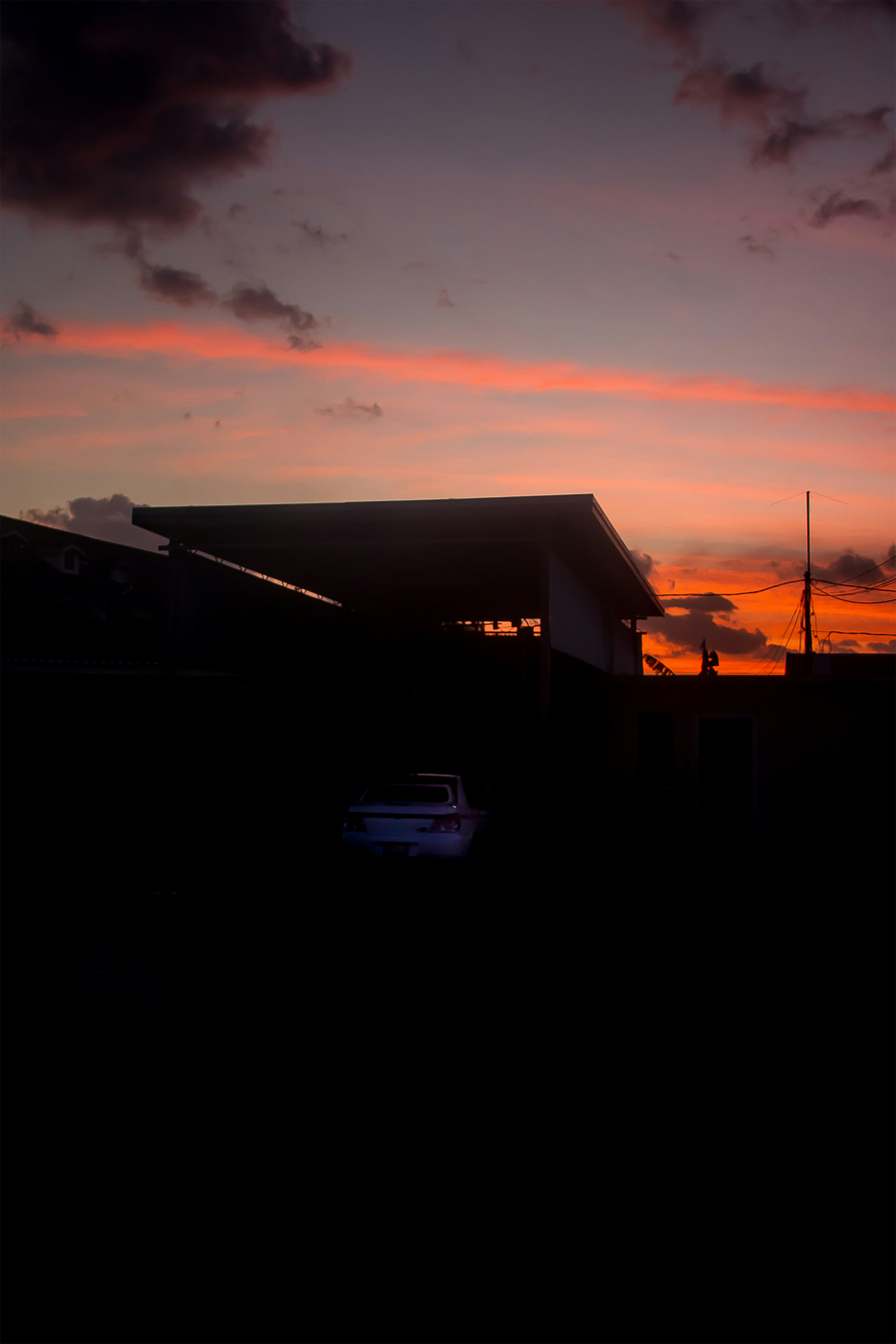 Dramatic sunset behind a building and car silhouette. photo – Free Car ...