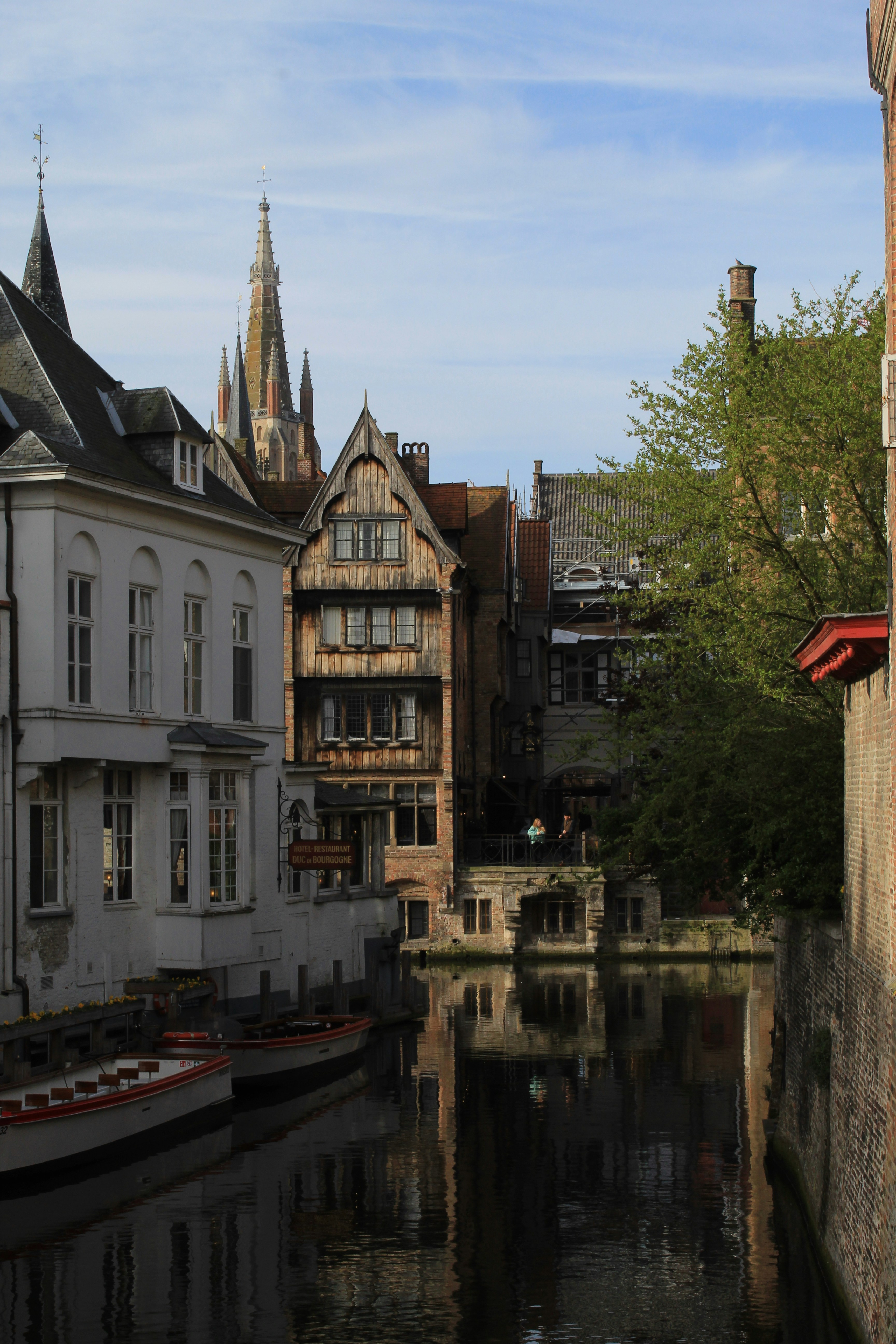Sunlit Canal Between Timeless Houses