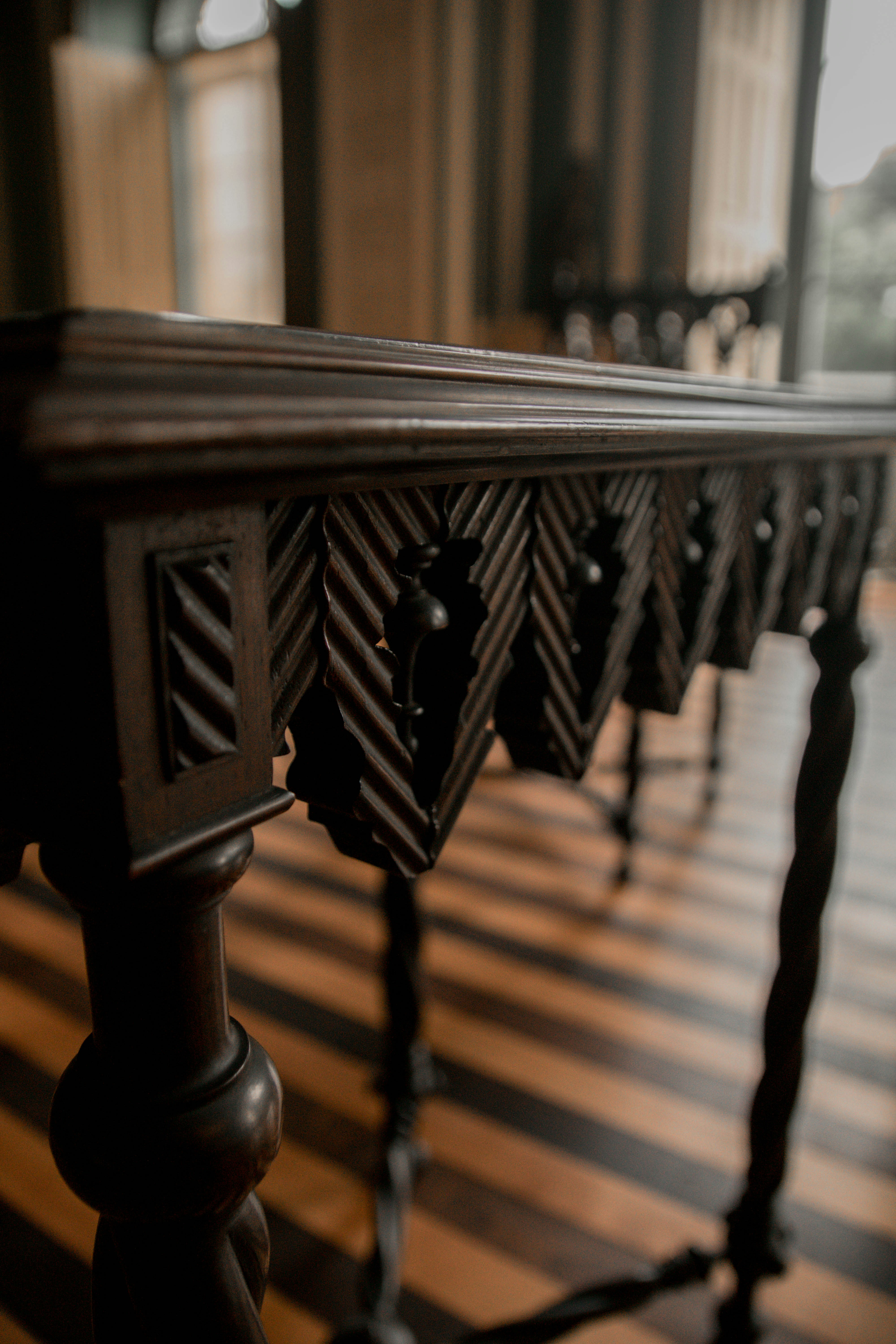 Carved Wooden Railing in Warm Indoor Light