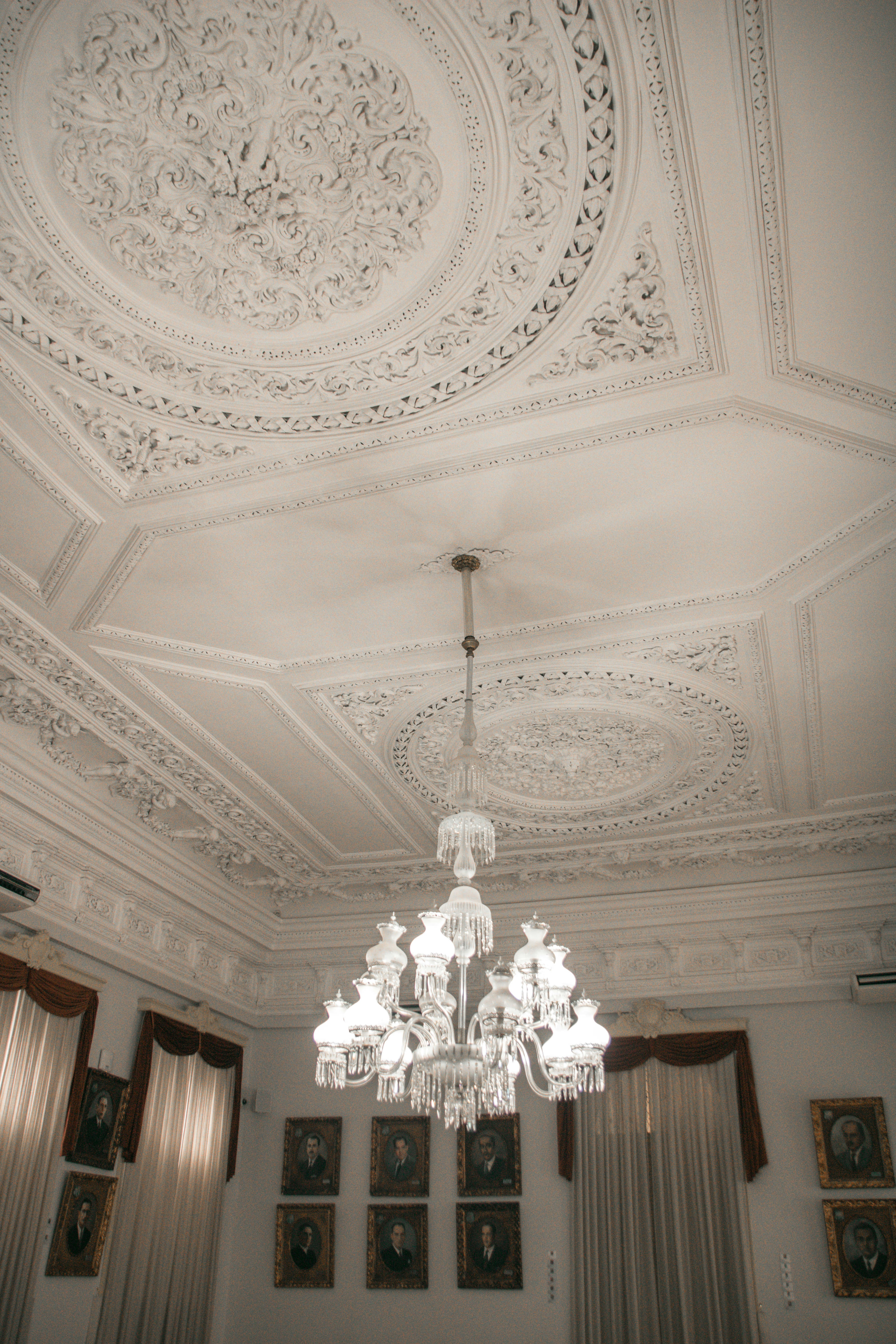 Intricate Ceilings and Crystal Chandelier in a Formal Hall
