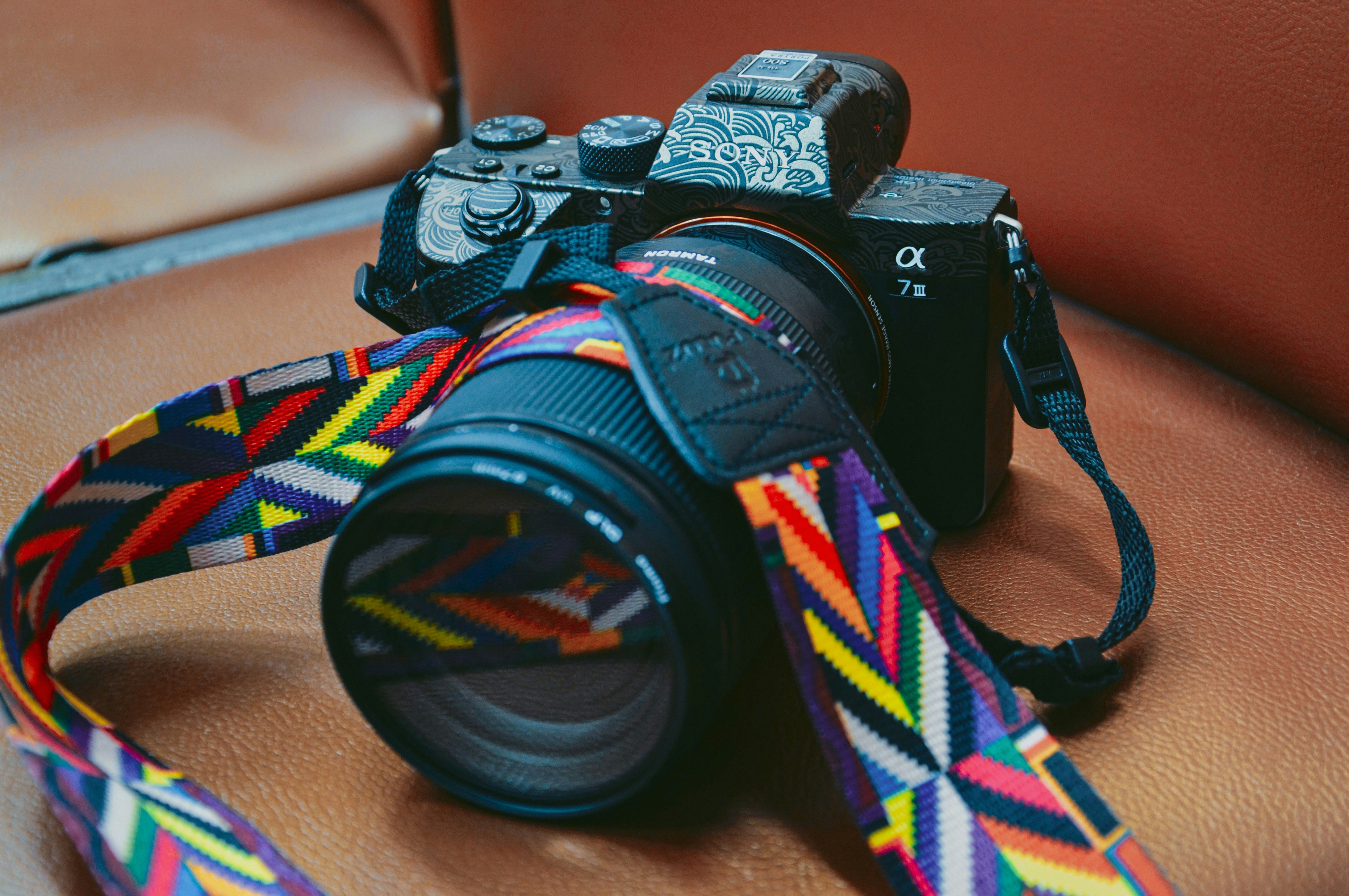 Colors in Focus: A Vintage Mirrorless Moment on a Patterned Strap