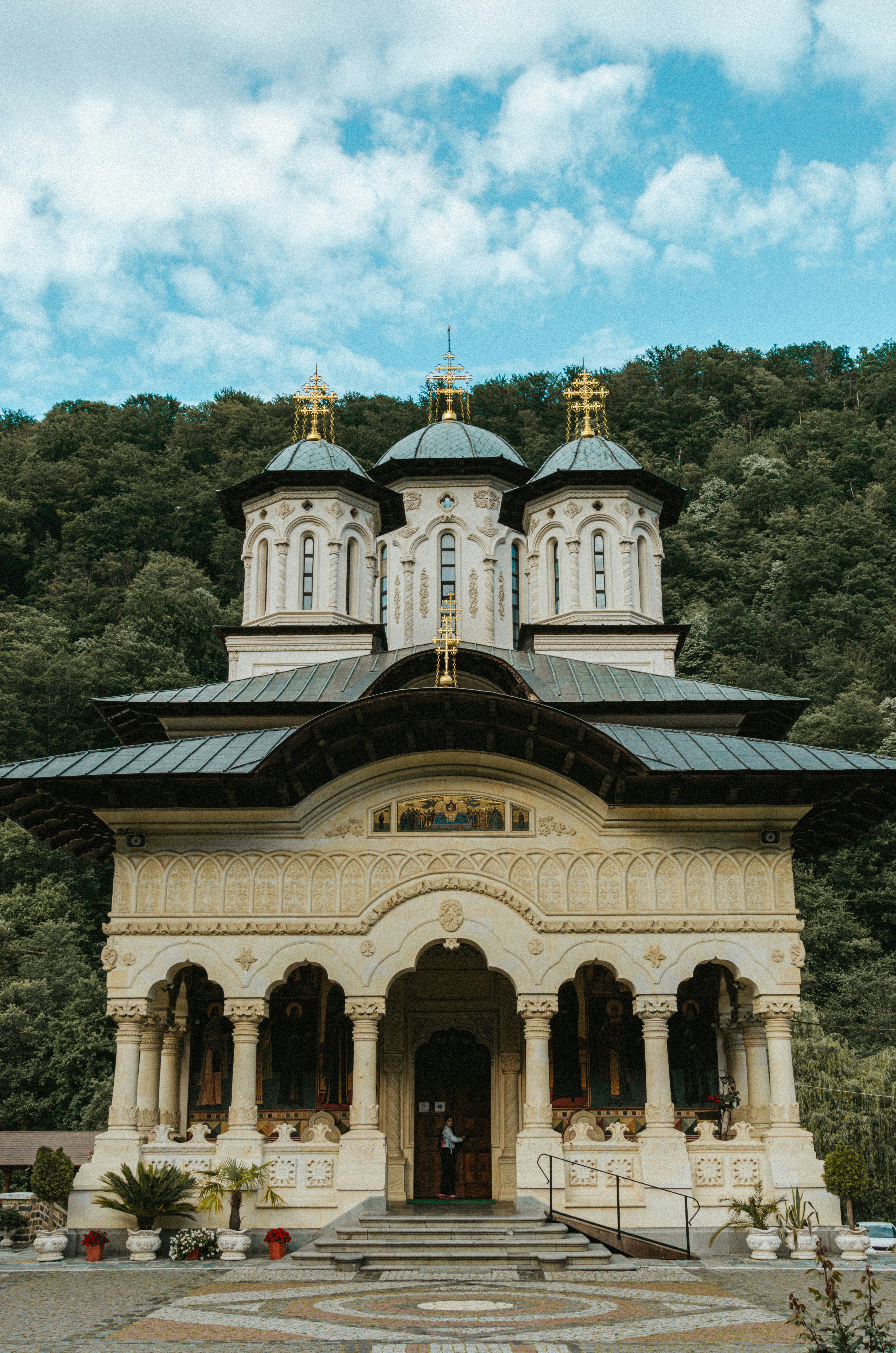 Ornate Orthodox Chapel Rising from Green Slopes