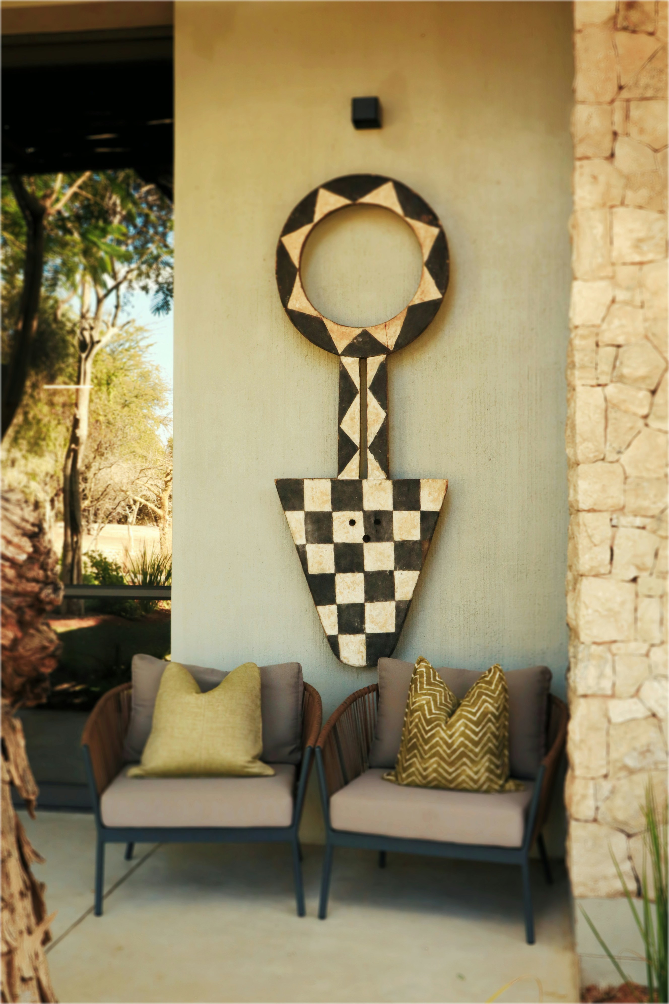 Abstract sun emblem above a cozy seating alcove