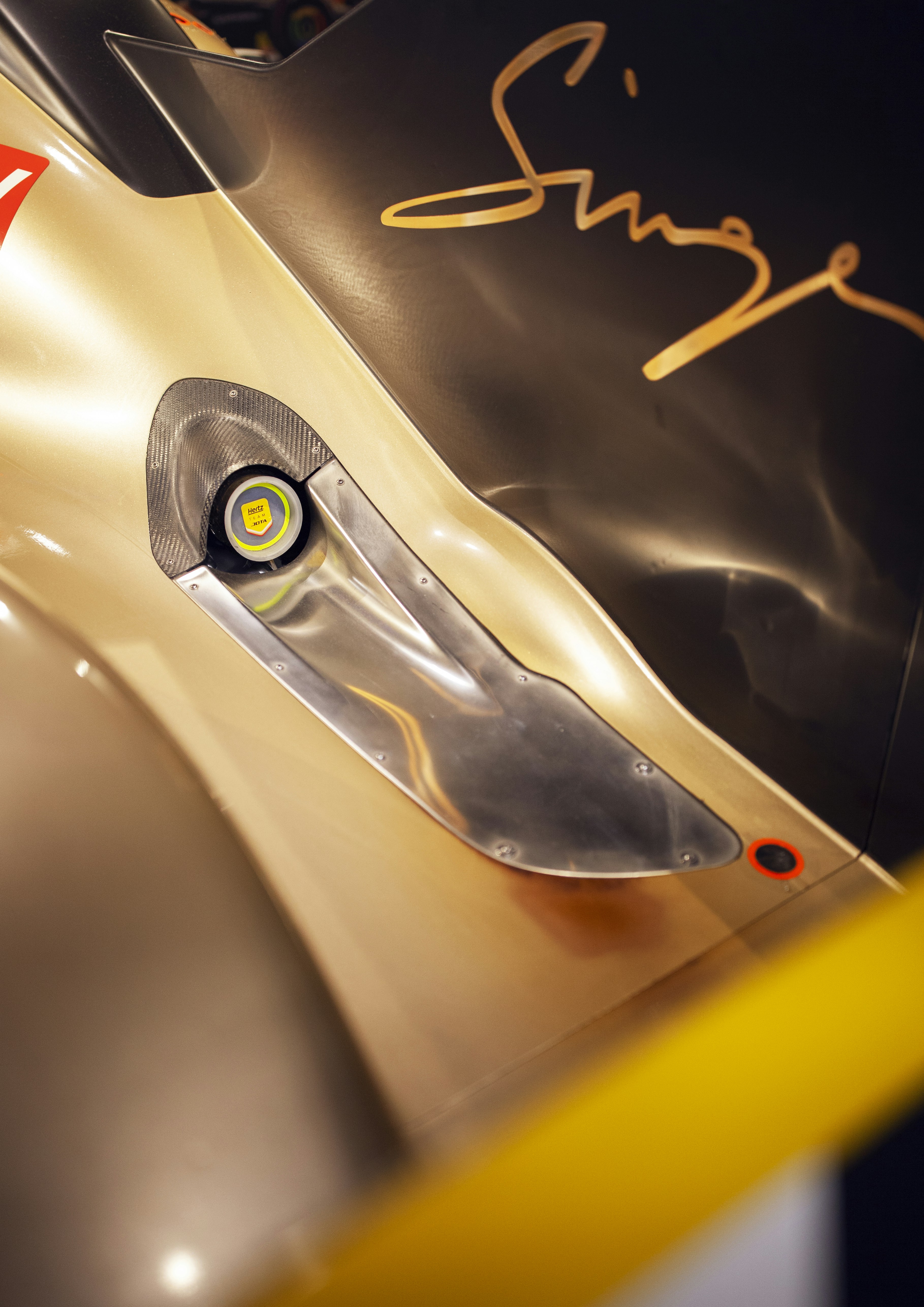 Shimmering fuel cap on a vintage alloy panel
