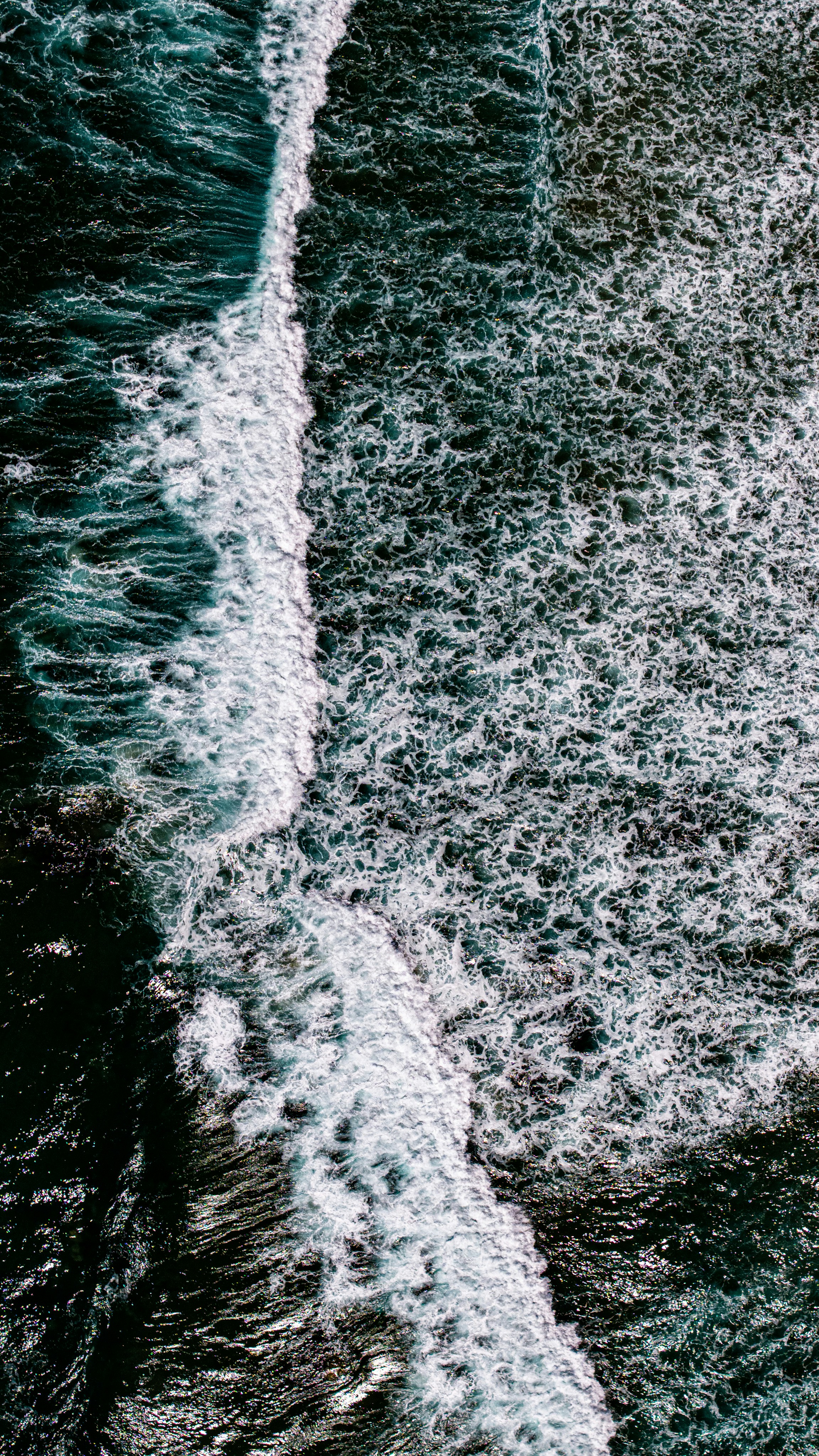 Vertical Currents: Aerial Poise over Turquoise Whitewash
