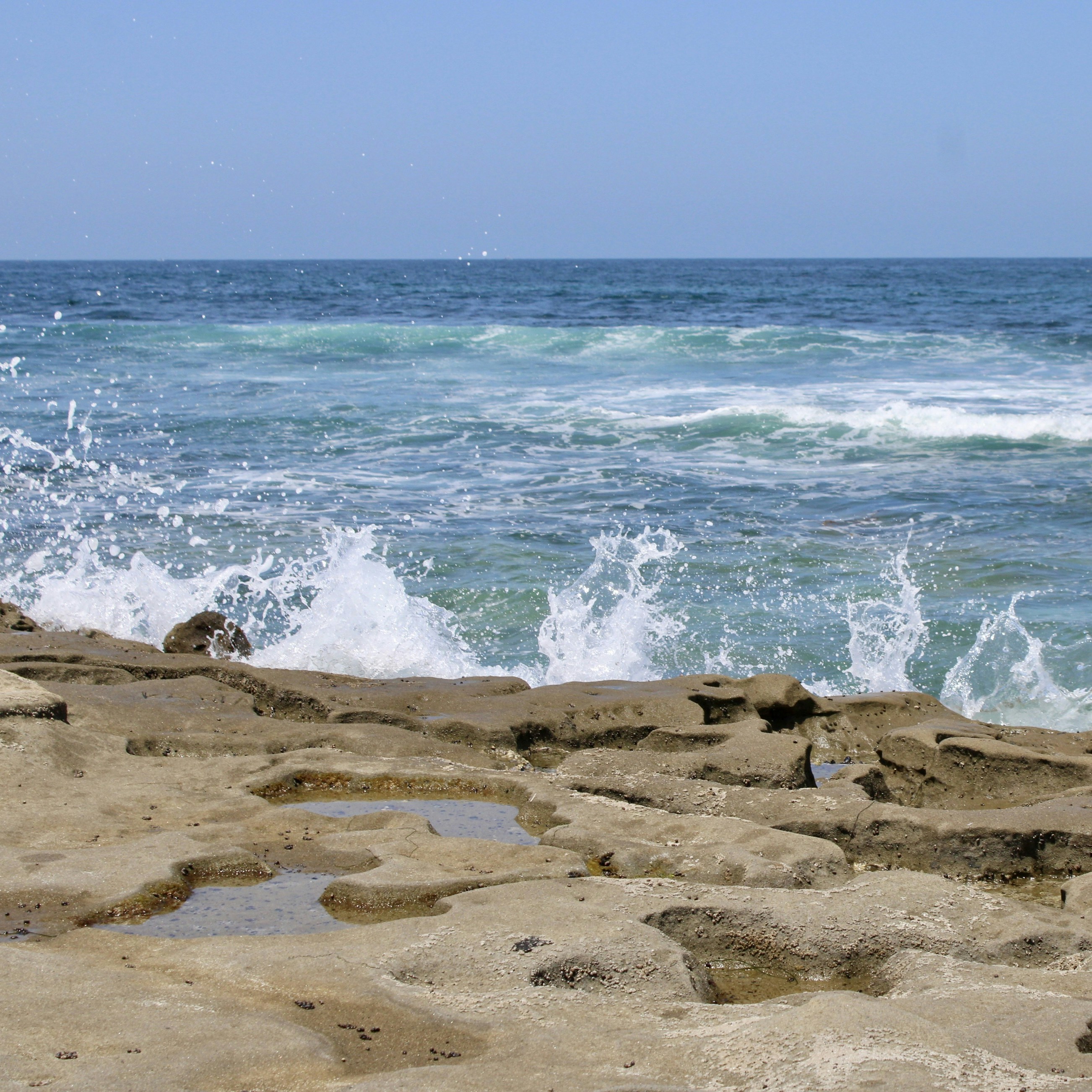 Sculpted Tidebreak at the Rocky Shoreline