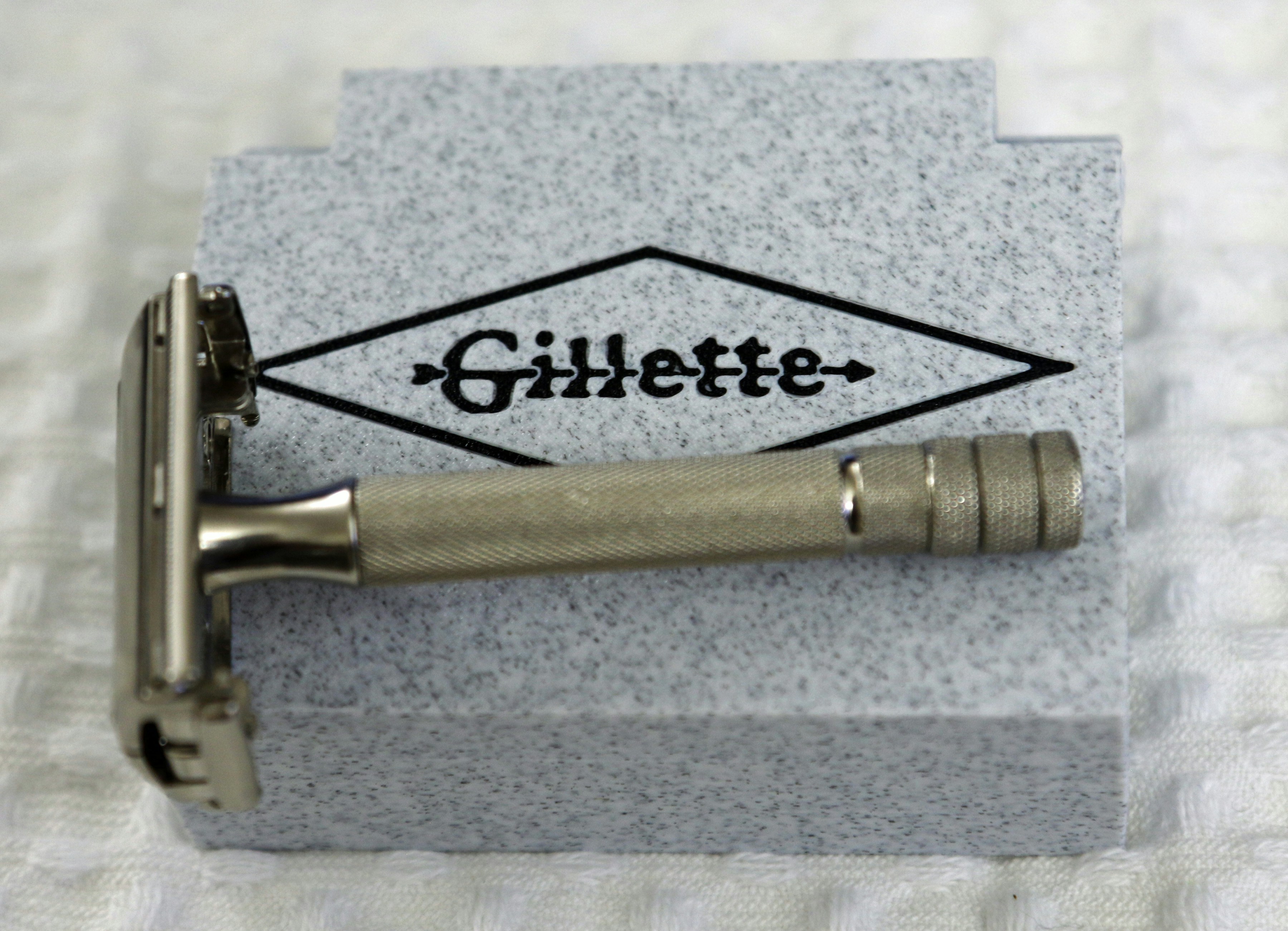 Gillette Razor Resting on Textured Stone Block