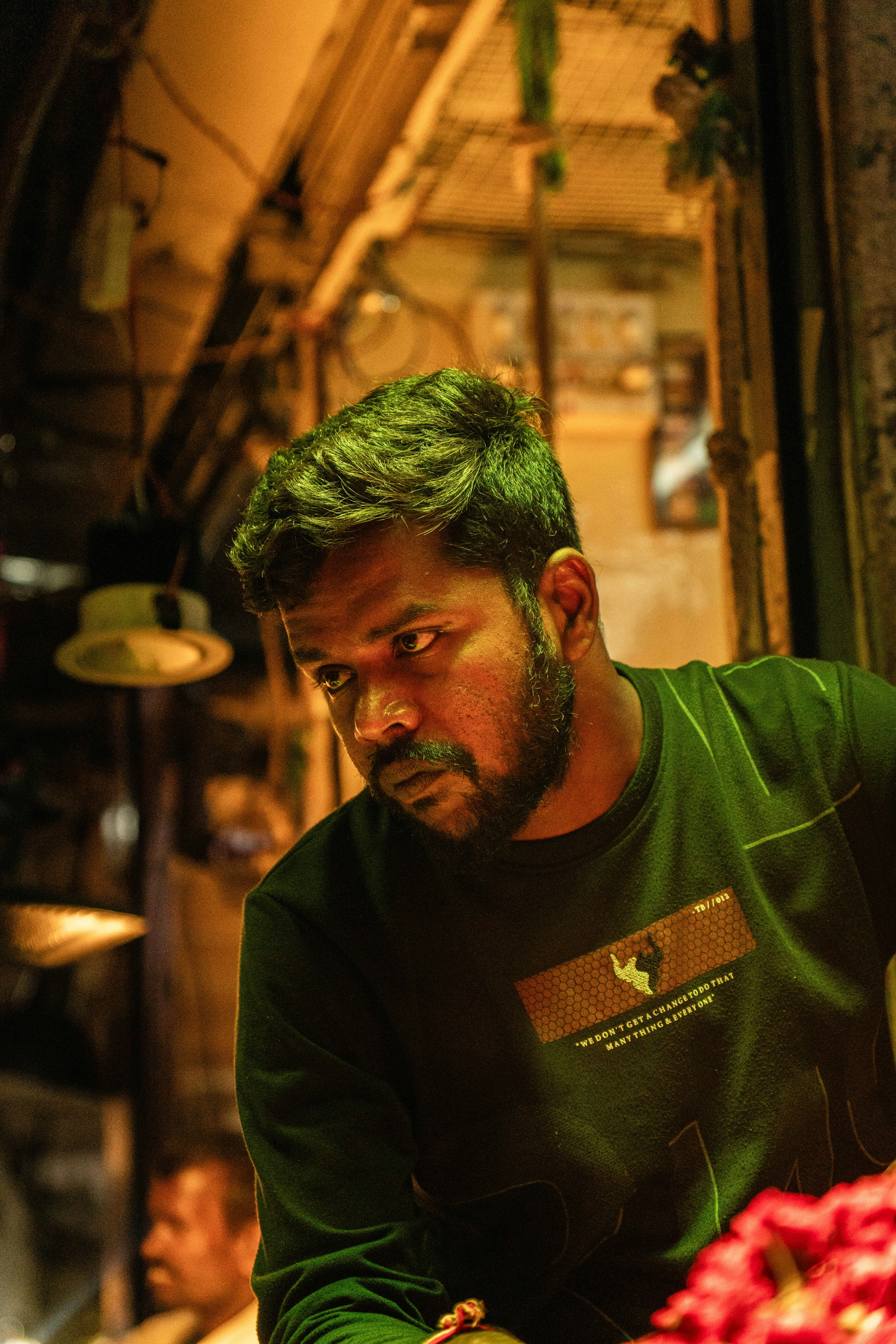 Midnight Street Portrait: Focused Gaze in Warm Industrial Light