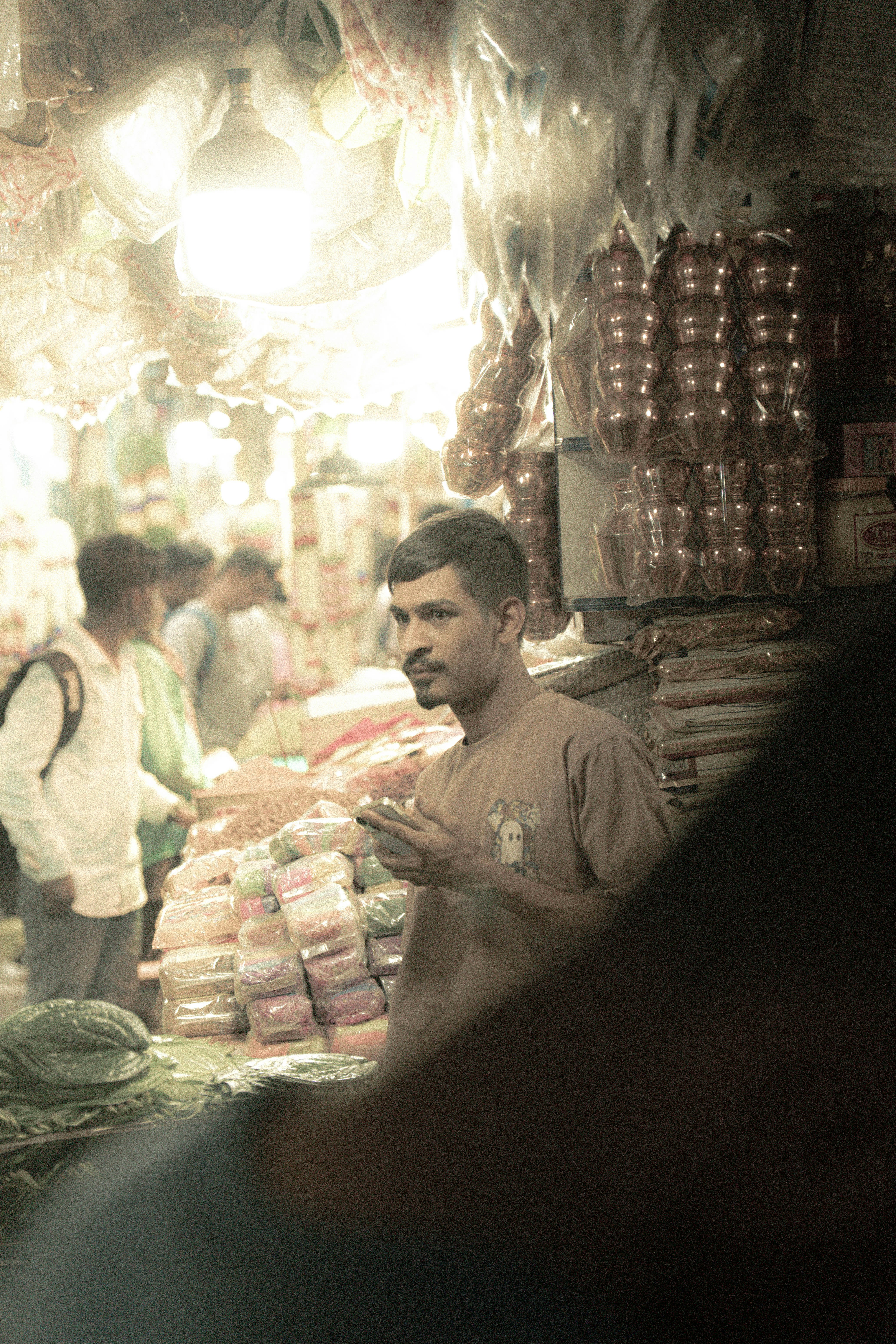 Market Portrait Under Warm Fluorescent Glow