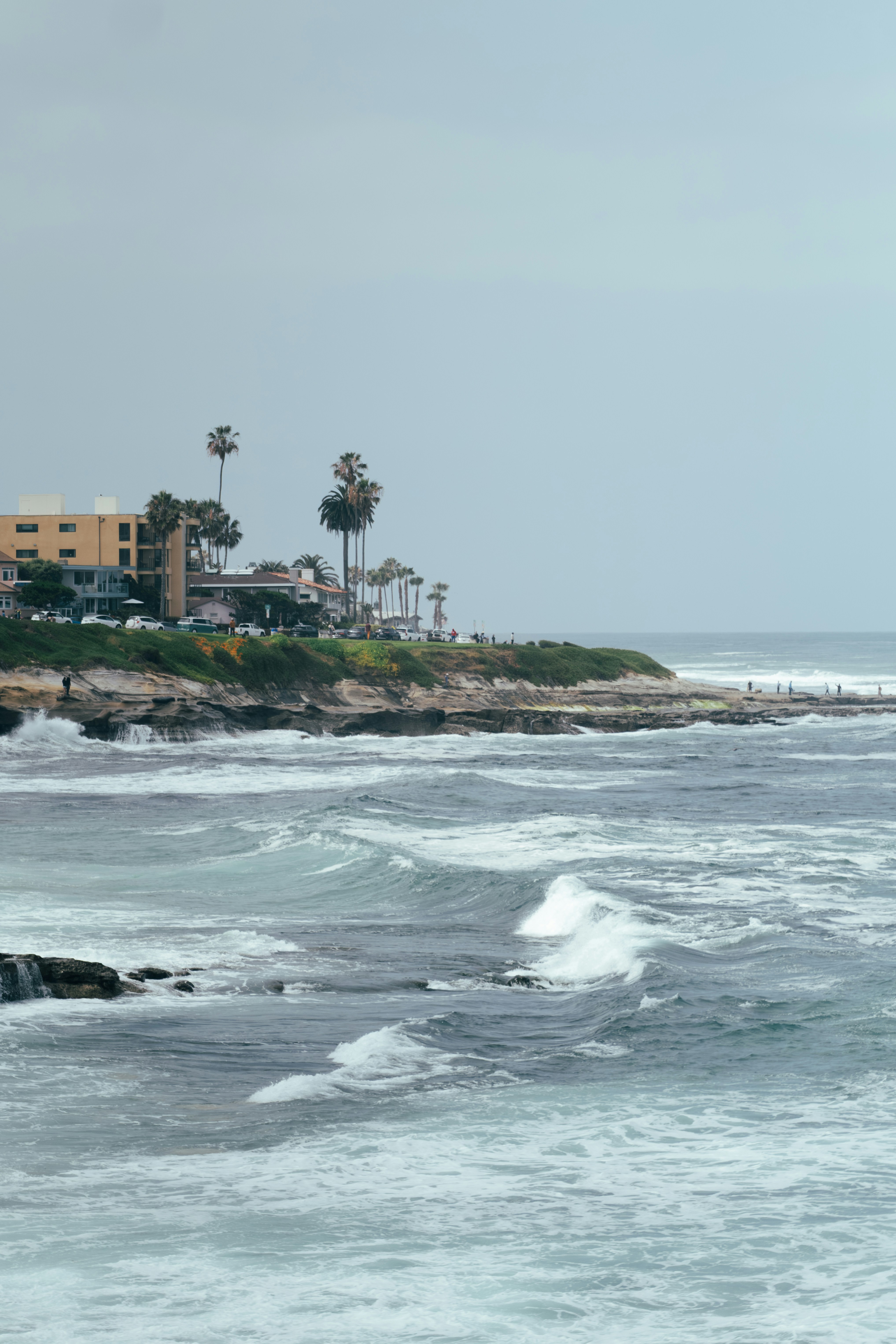 Coastal Edge: a quiet shoreline town beneath a pale morning sky