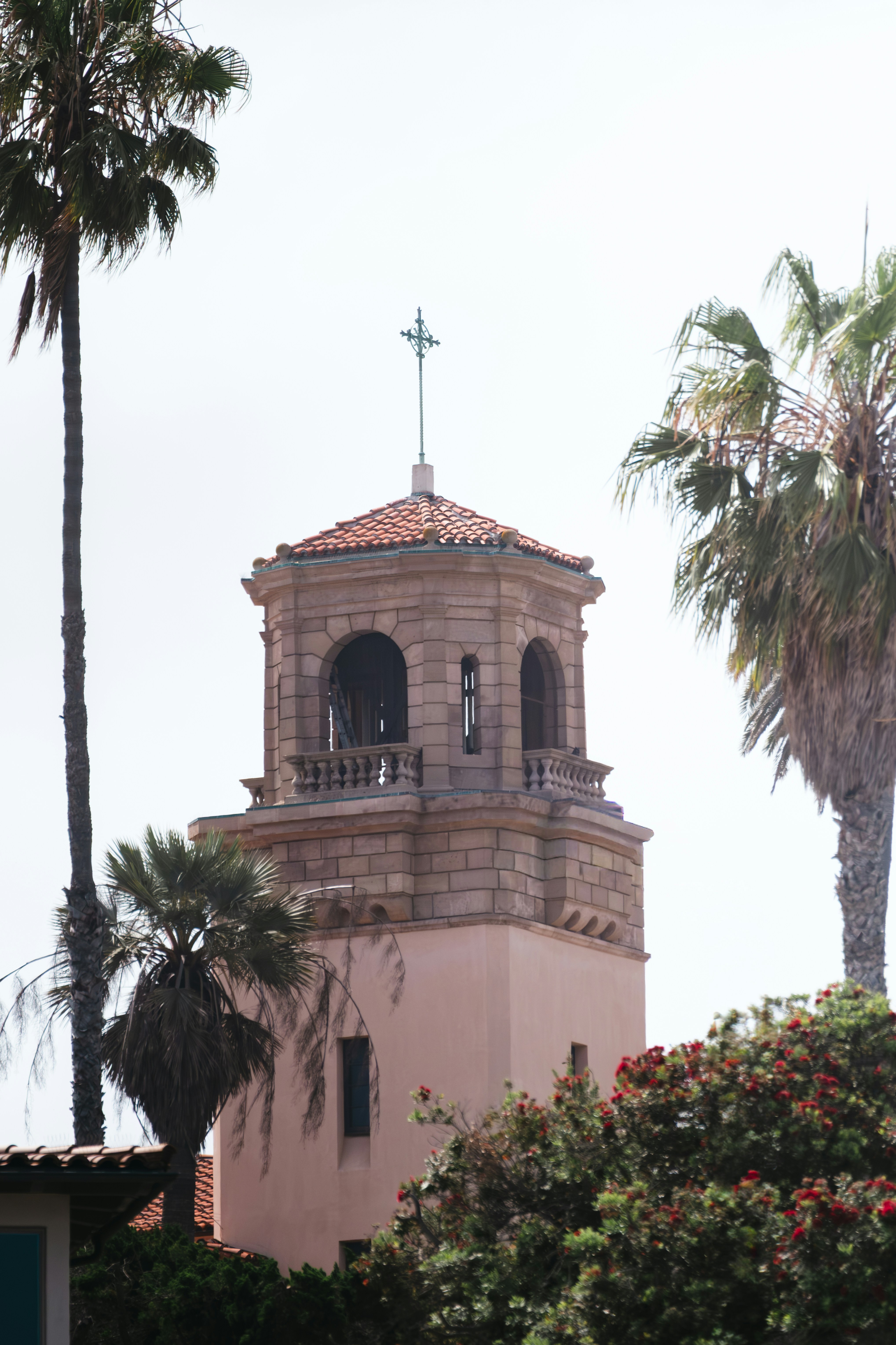 Carved Bell Tower Rising Above Palm Fronds