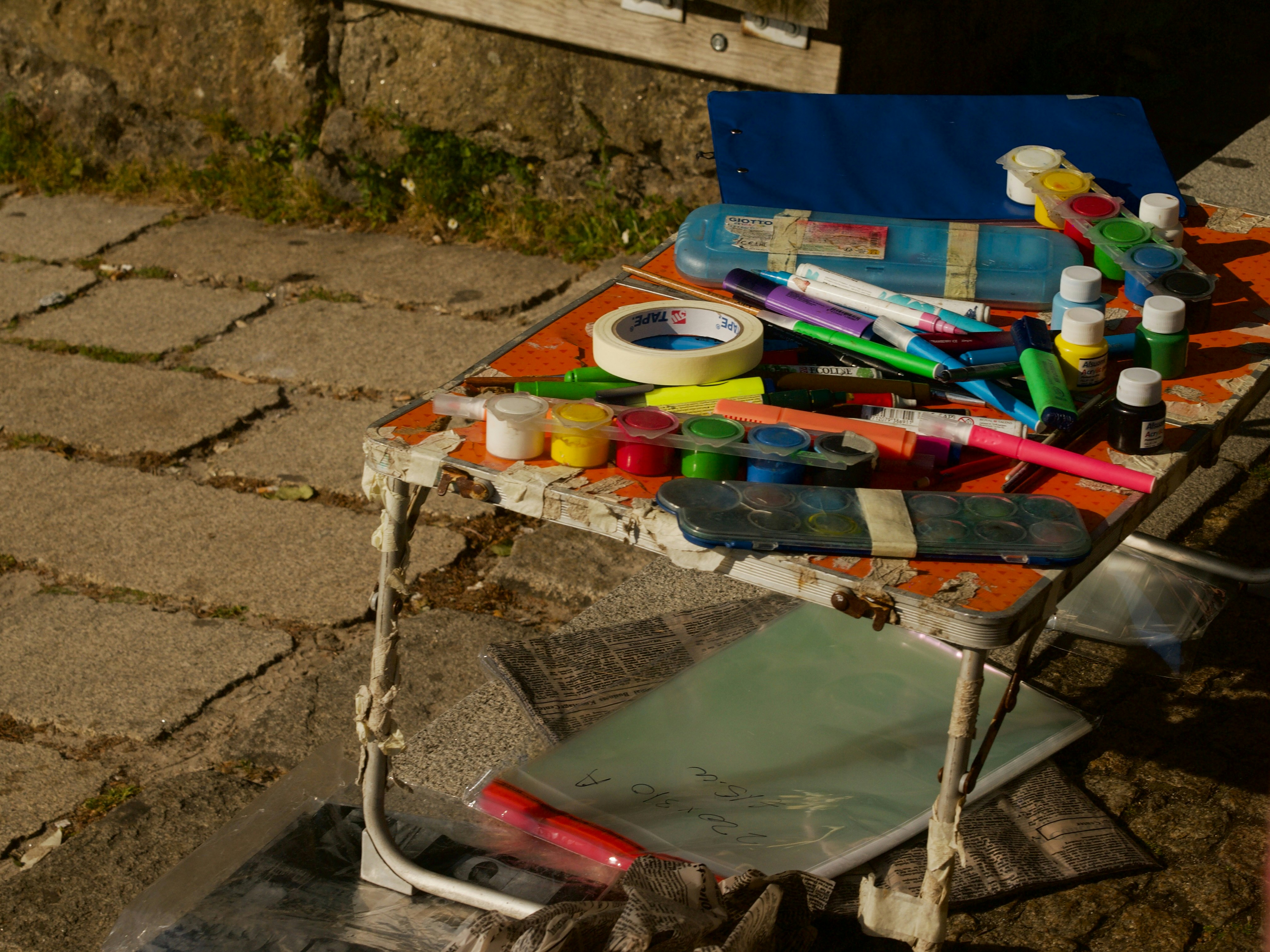 Colorful Art Station on a Worn Workbench