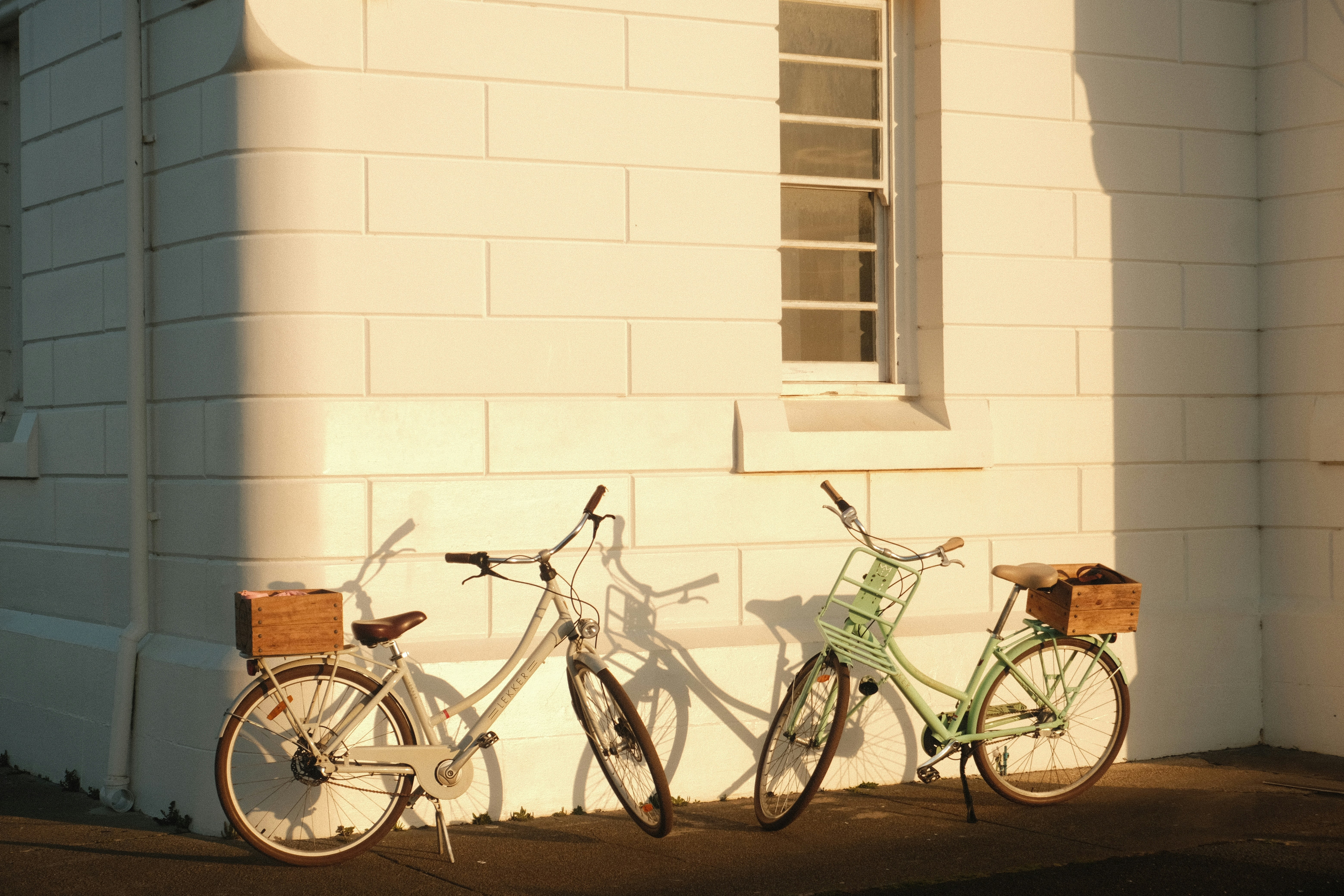 Sunlit Bikes by the Brick Wall