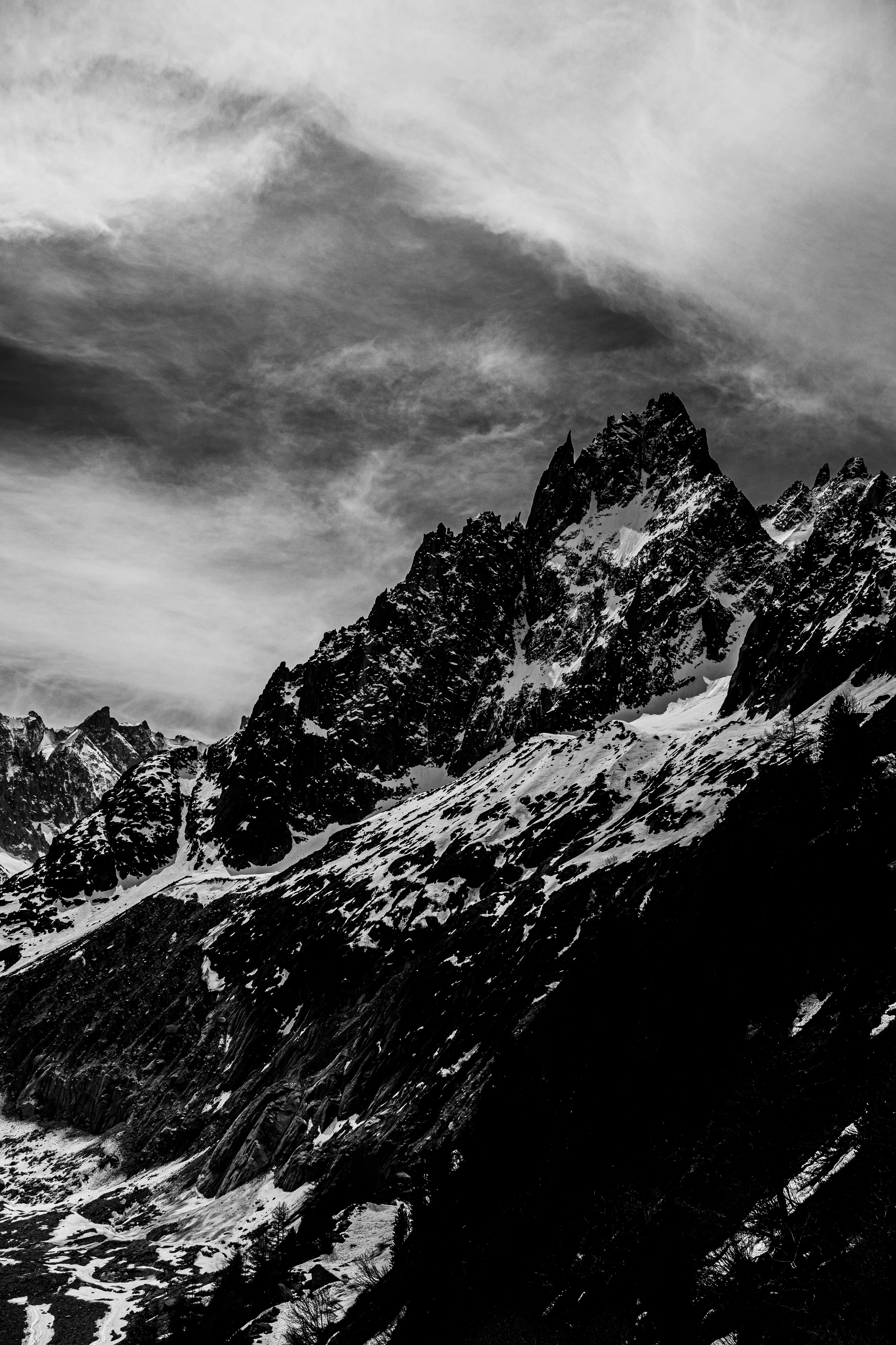 Crowned Ridge: Snow-Scaled Peaks Beneath a Moody Sky