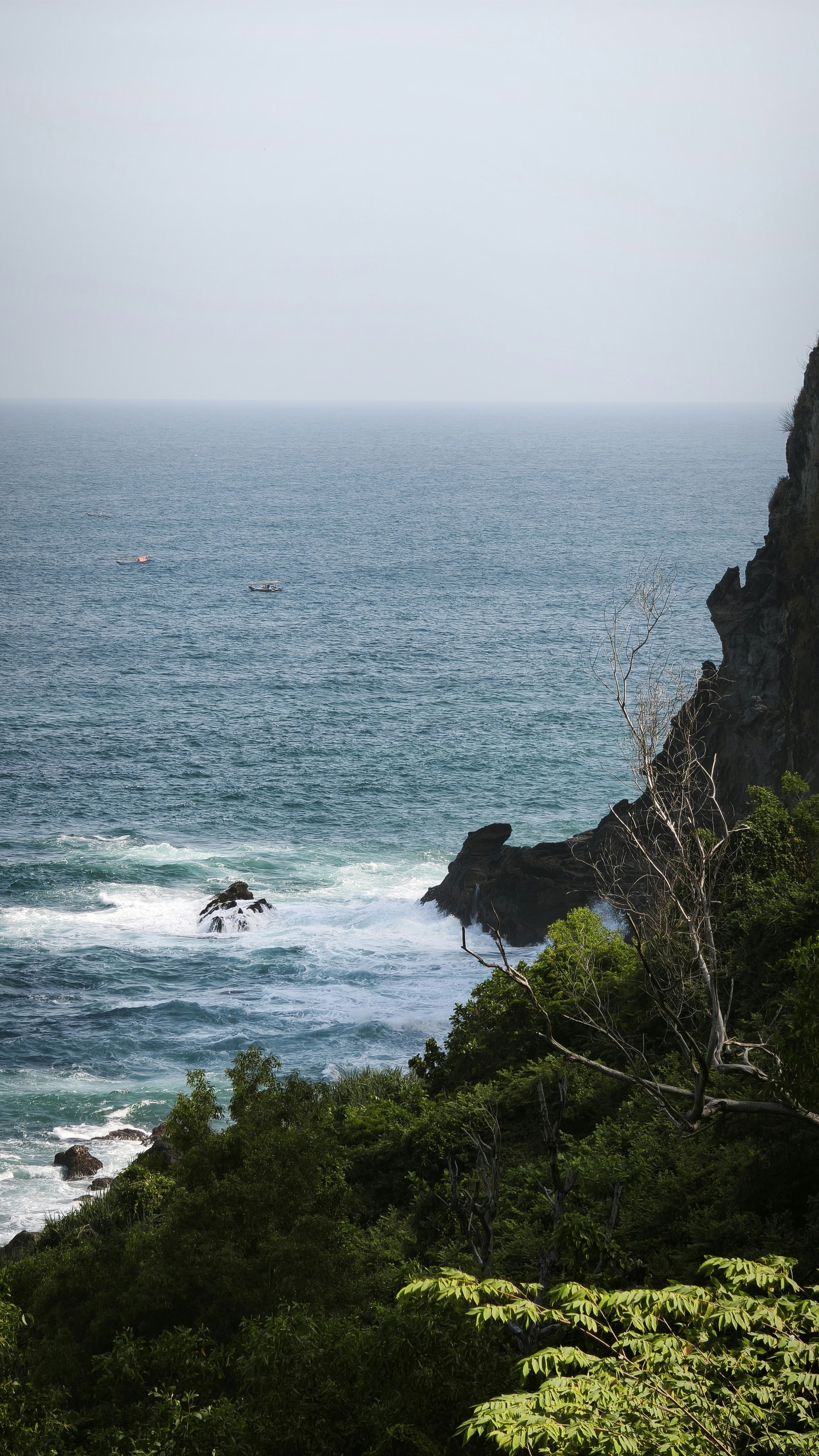 Cliffside to Calm: A Seascape Framed by Crags