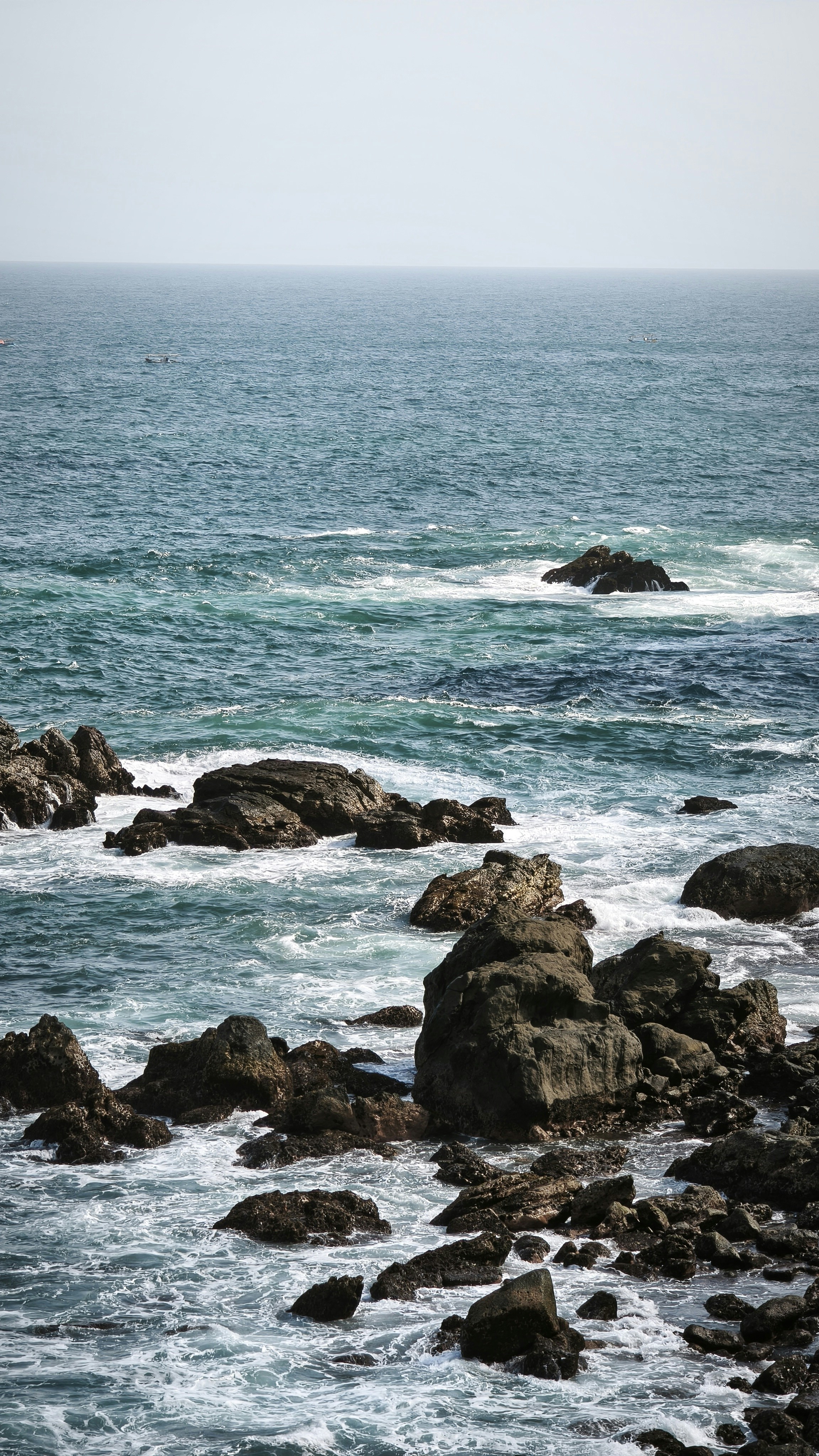 Rugged Sea Stackline: A Quiet Coast Bordered by Tumbled Rocks