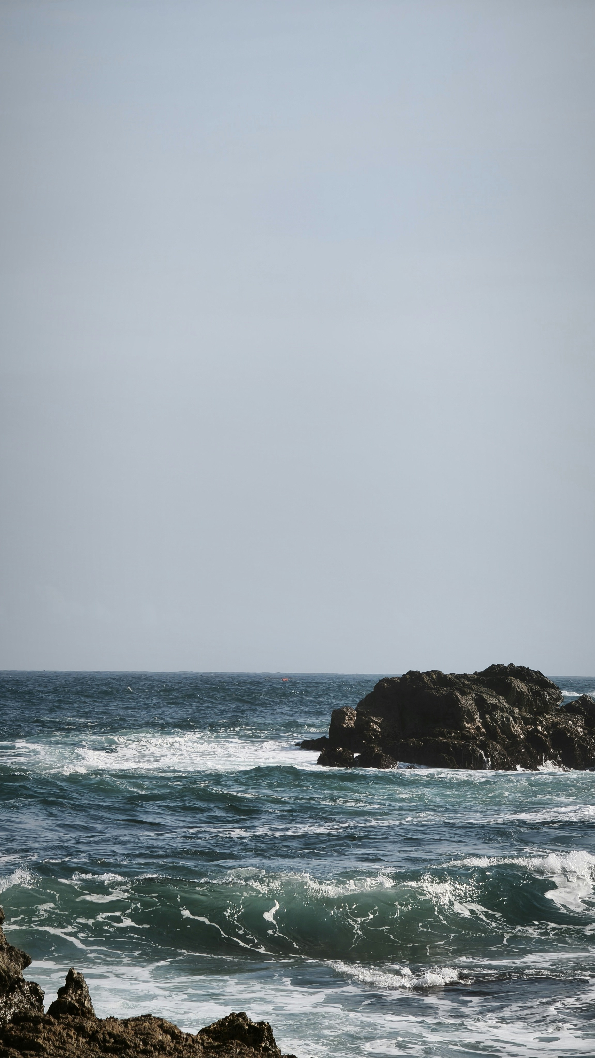 Rugged Sea Stack at Dusk: A Quiet Frontier of Waves and Stone