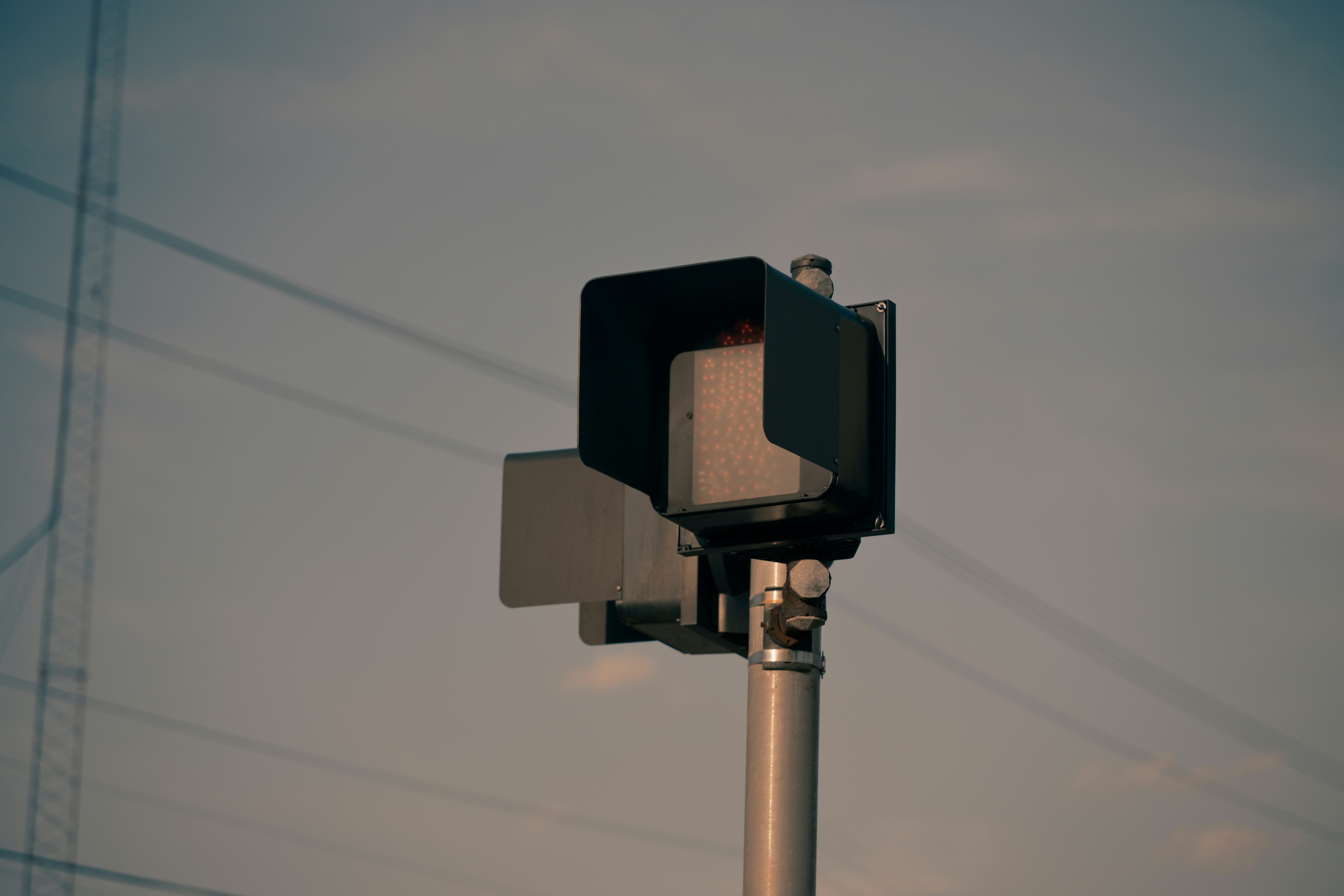 Signal Post with Protective Visor: A Quiet Streetlight Moment