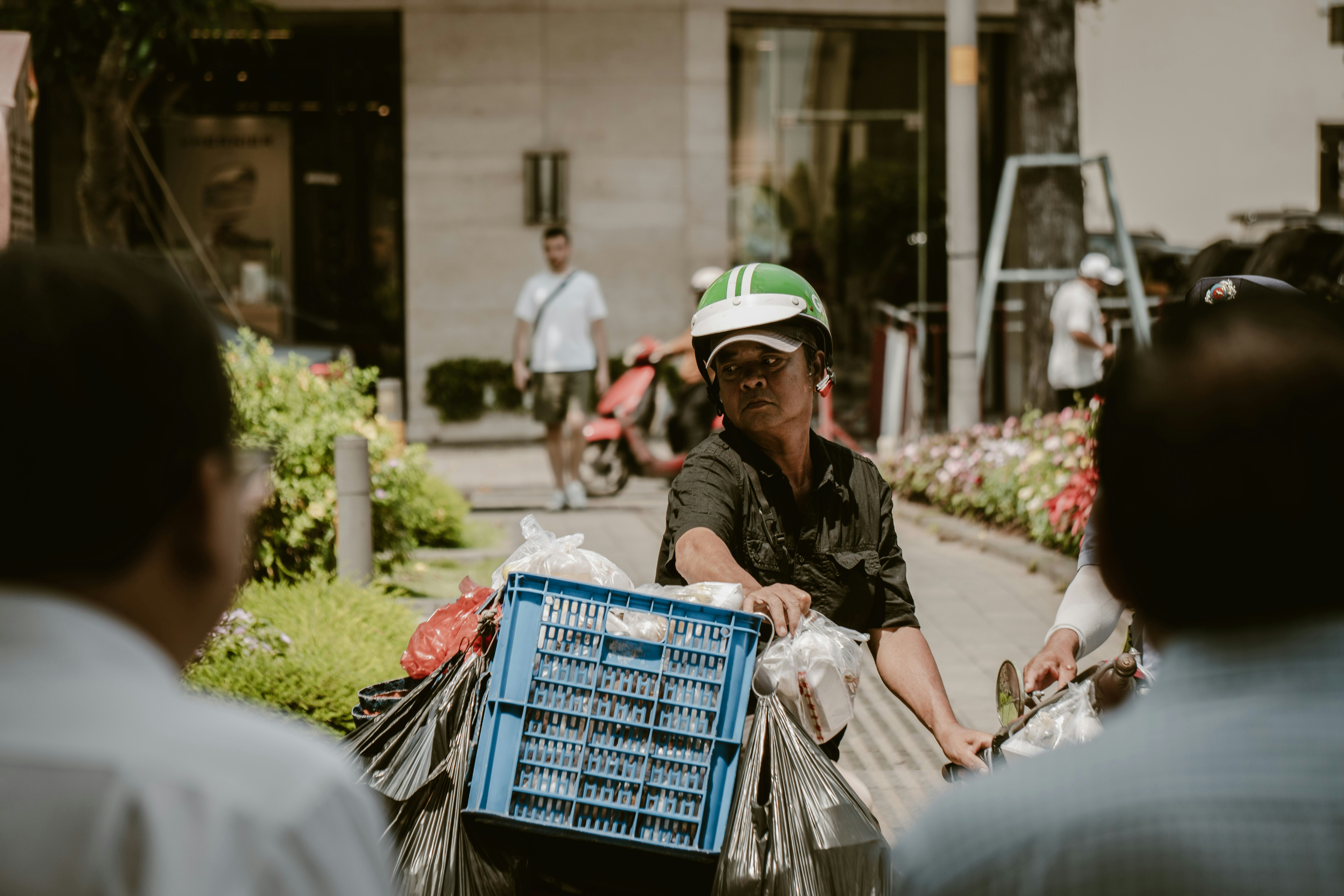 Frontline Vendor with Milk Crate Plea in a Bustling Street