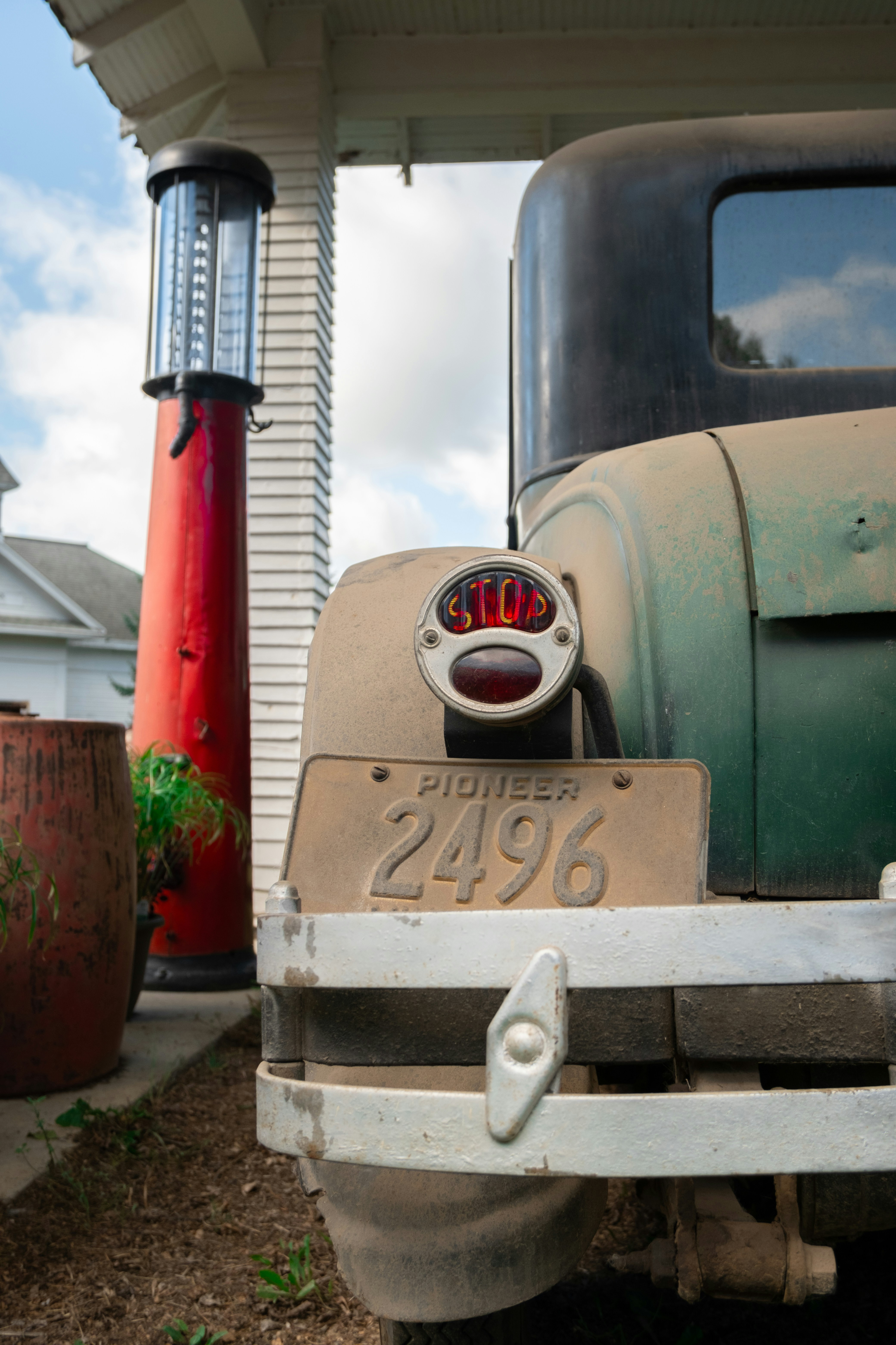 Rear View of a Dusty Pioneer Truck with Neon-Glow Tail Light