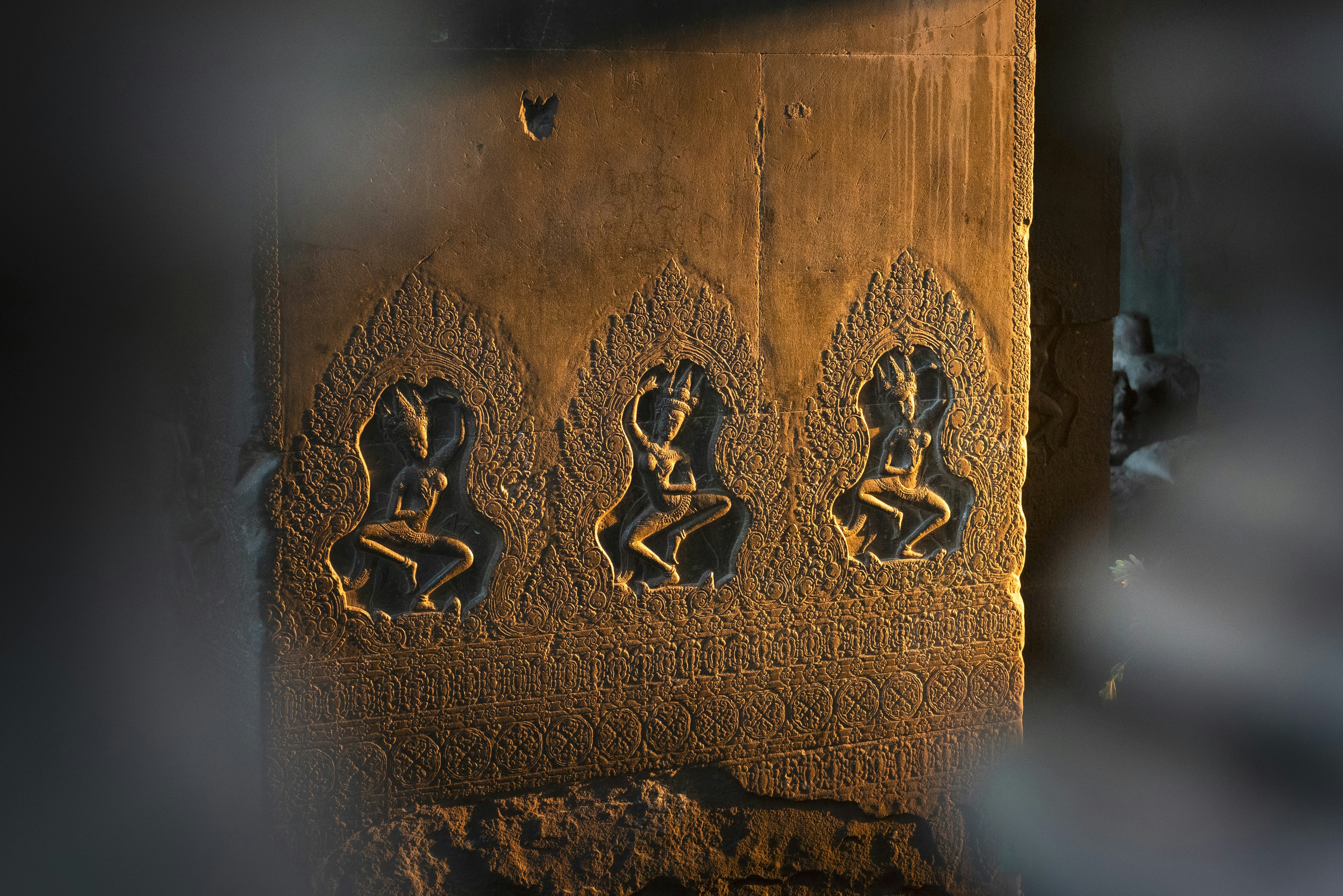 Carved Duo of Dancers in Obscured Portal